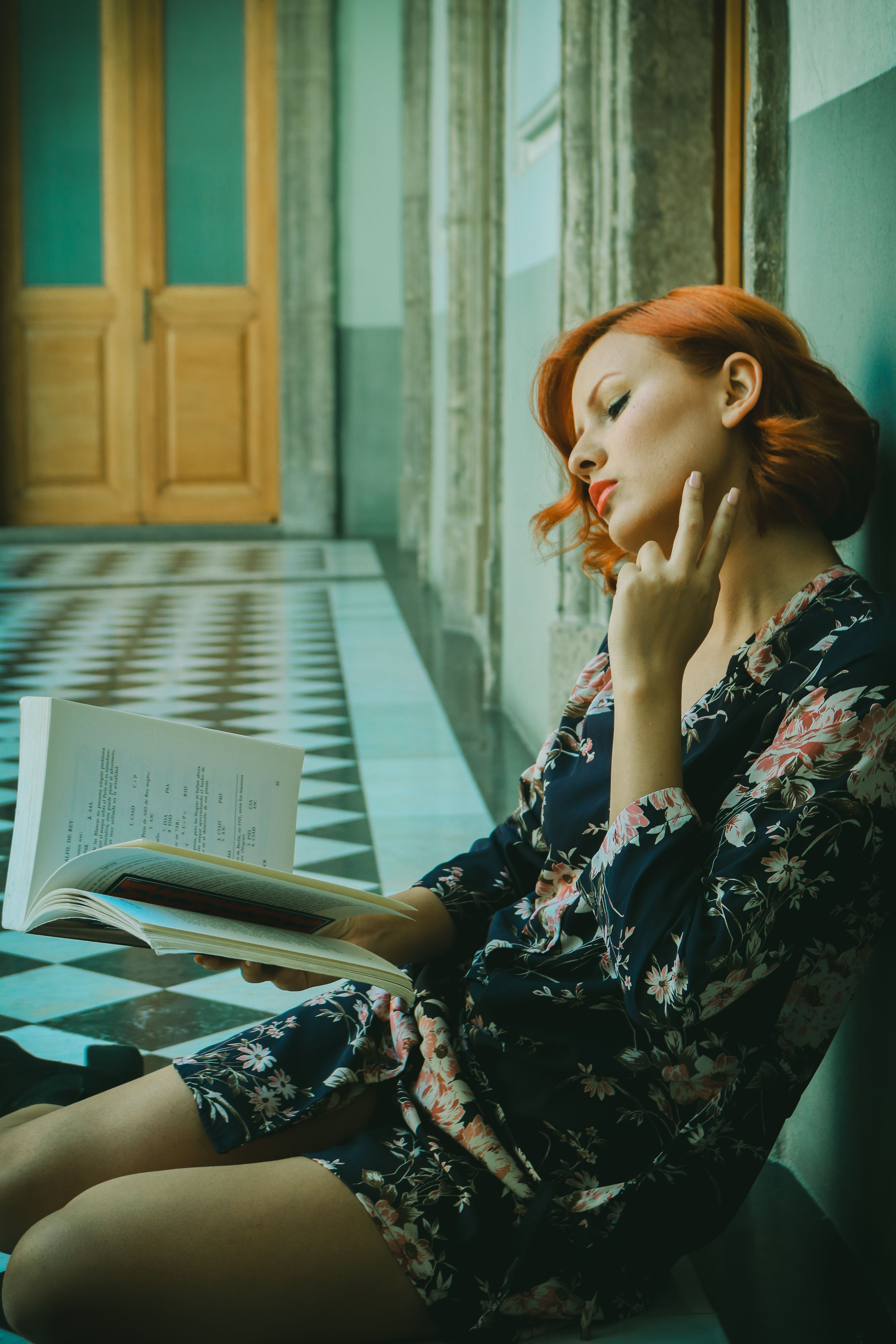 Redhead Woman Reading Book · Free Stock Photo