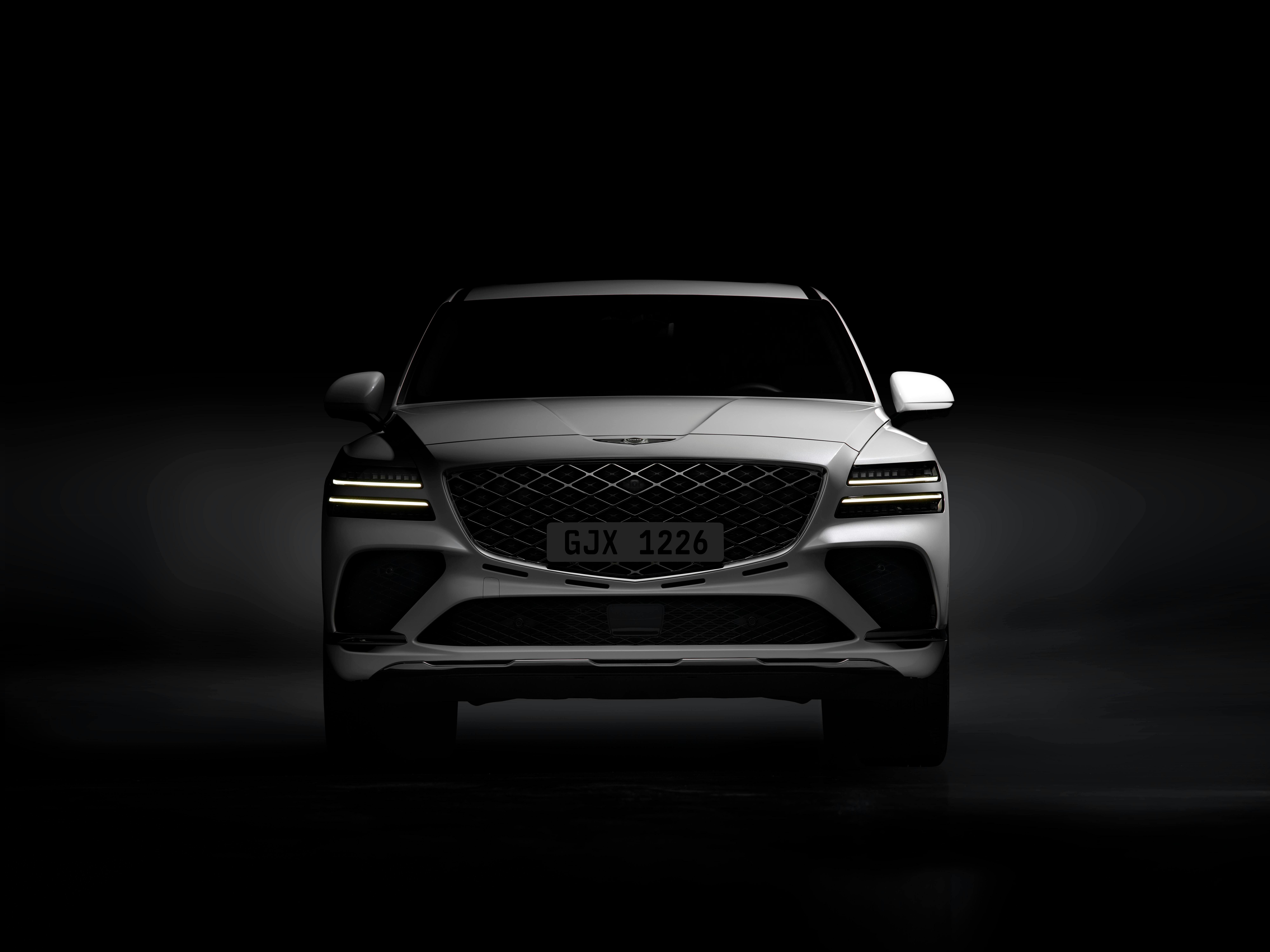 The front view of the GV80 Coupe standing in a dark studio. · Free ...