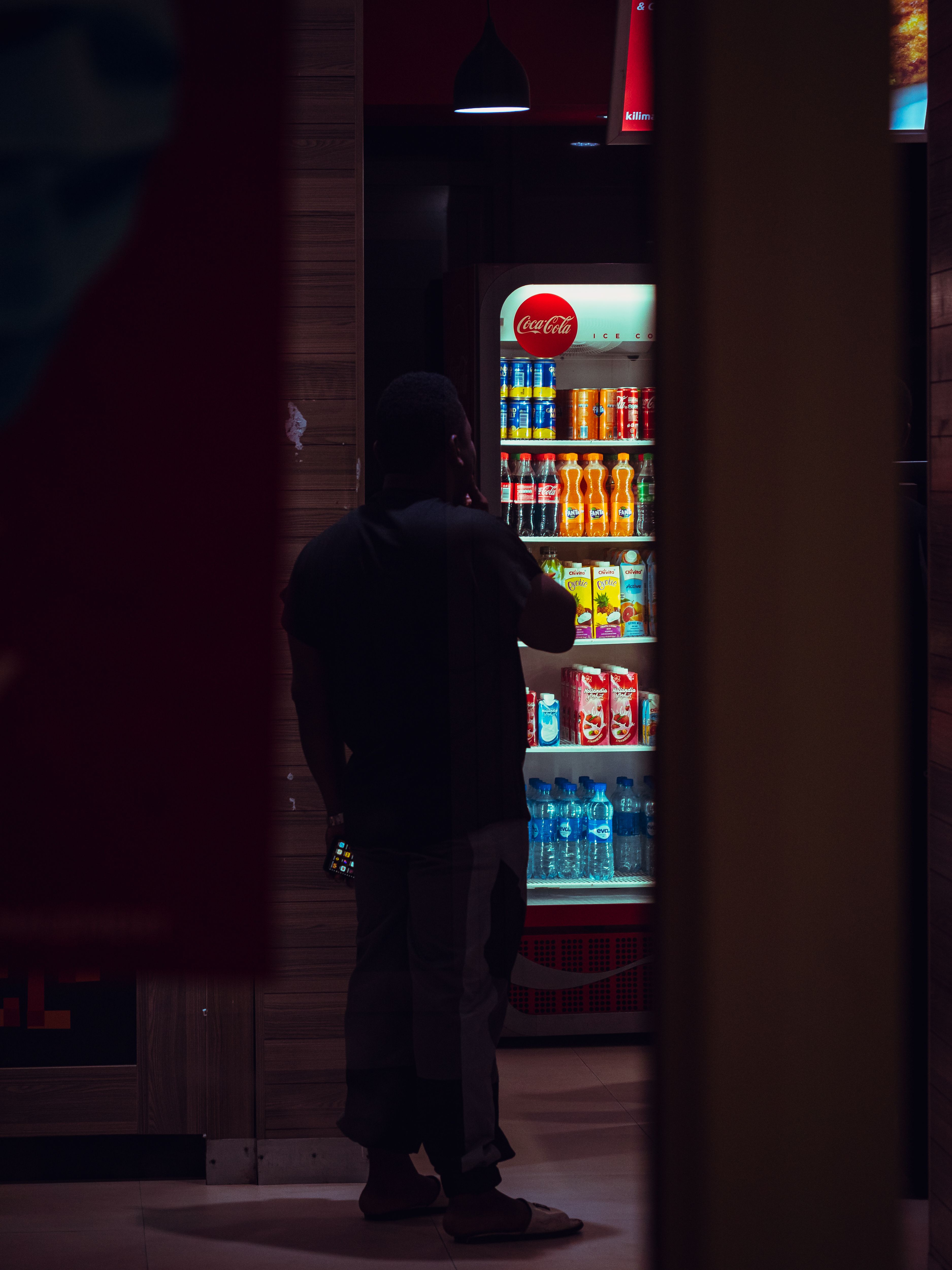 Man in Front of a Vending Machine at Night · Free Stock Photo