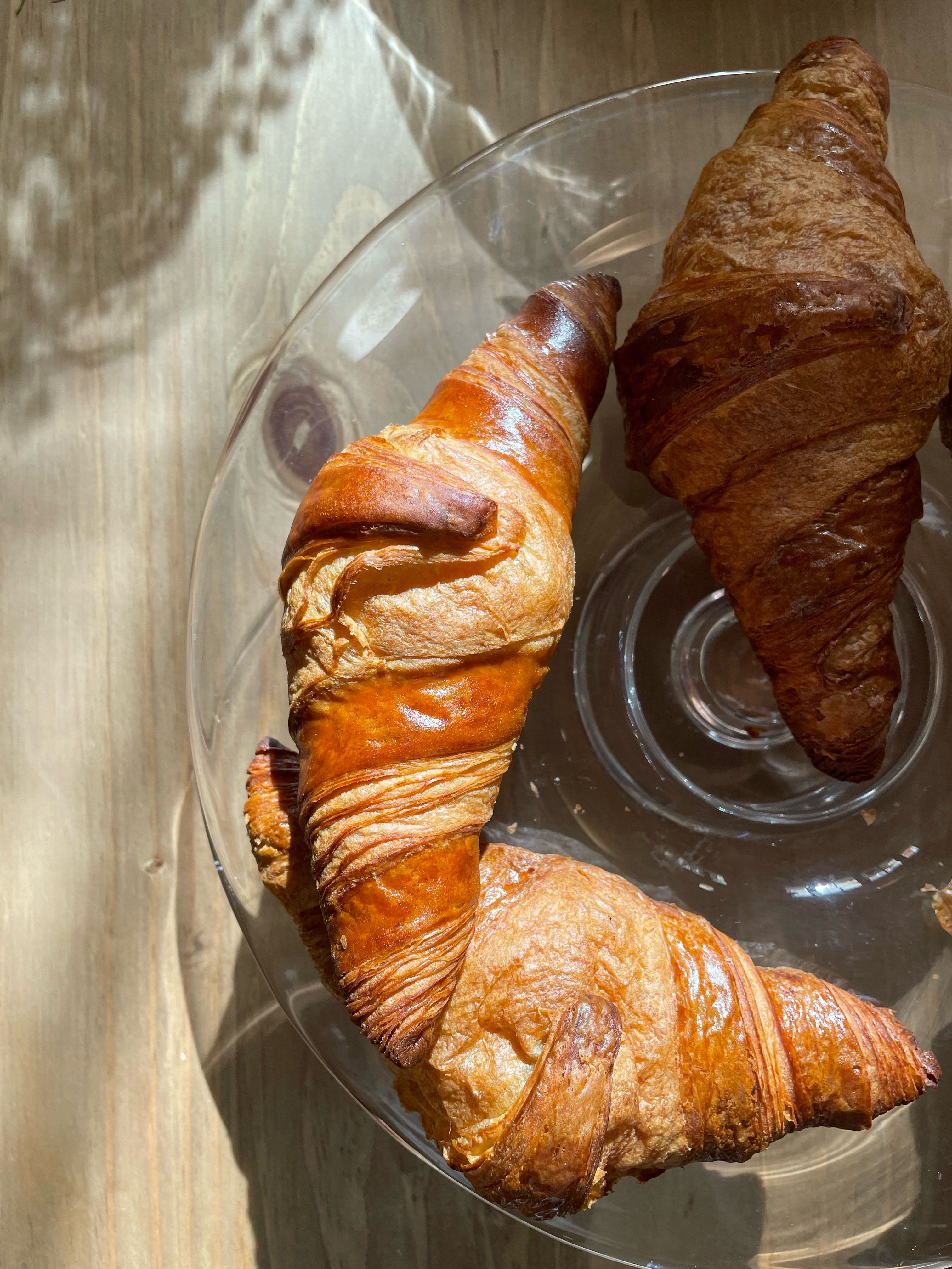 Croissants on a Glass Plate · Free Stock Photo