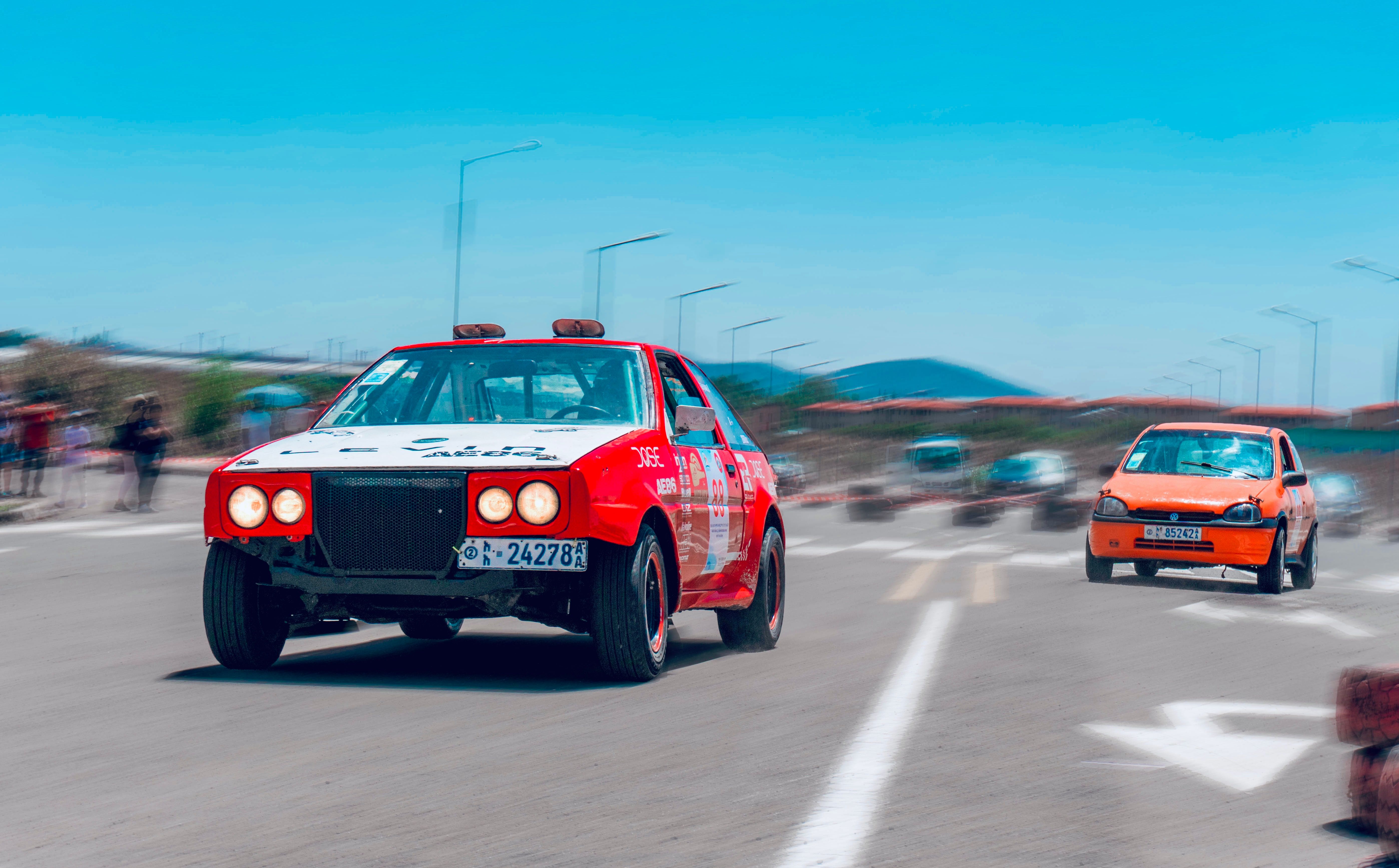 Cars Racing on a Road · Free Stock Photo