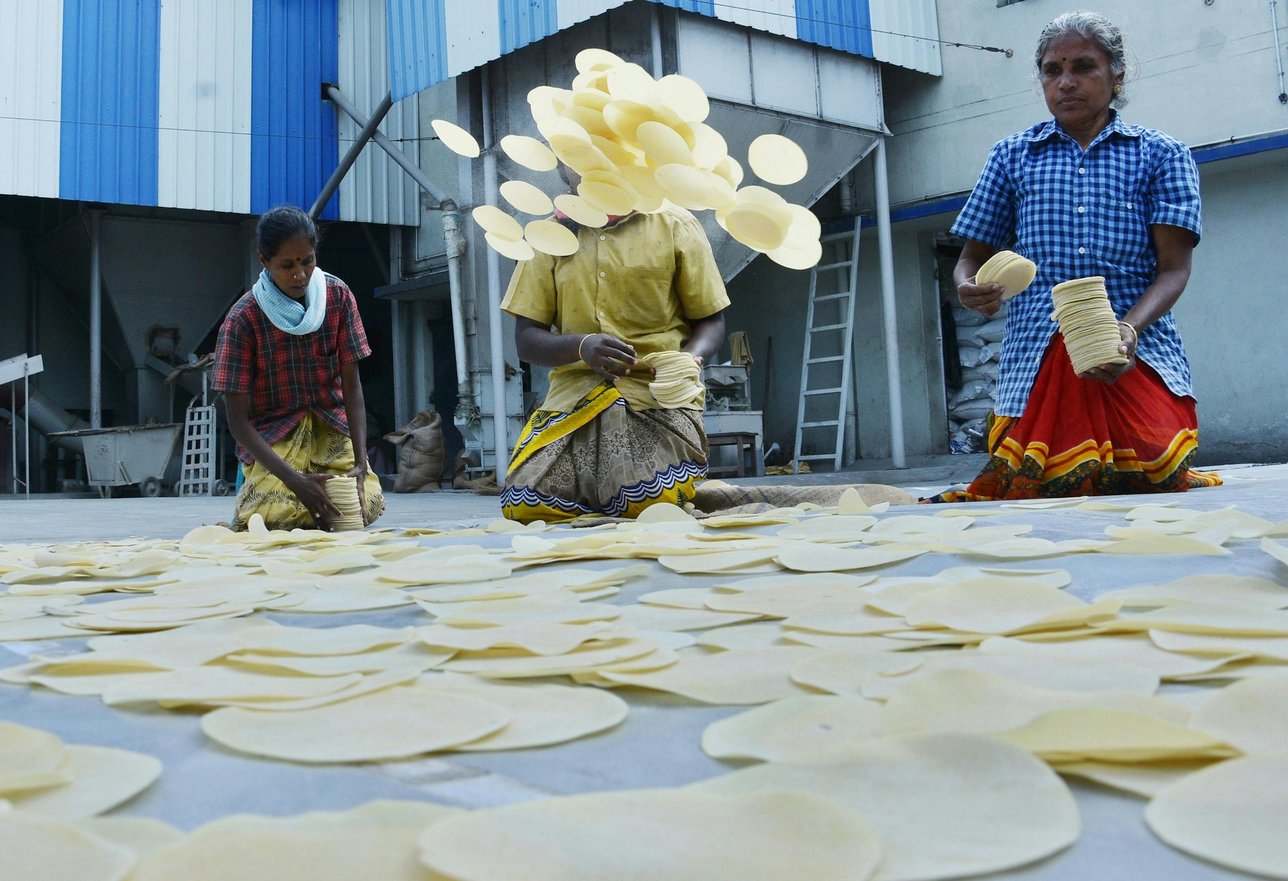 Women working in a papad company drying pappad · Free Stock Photo