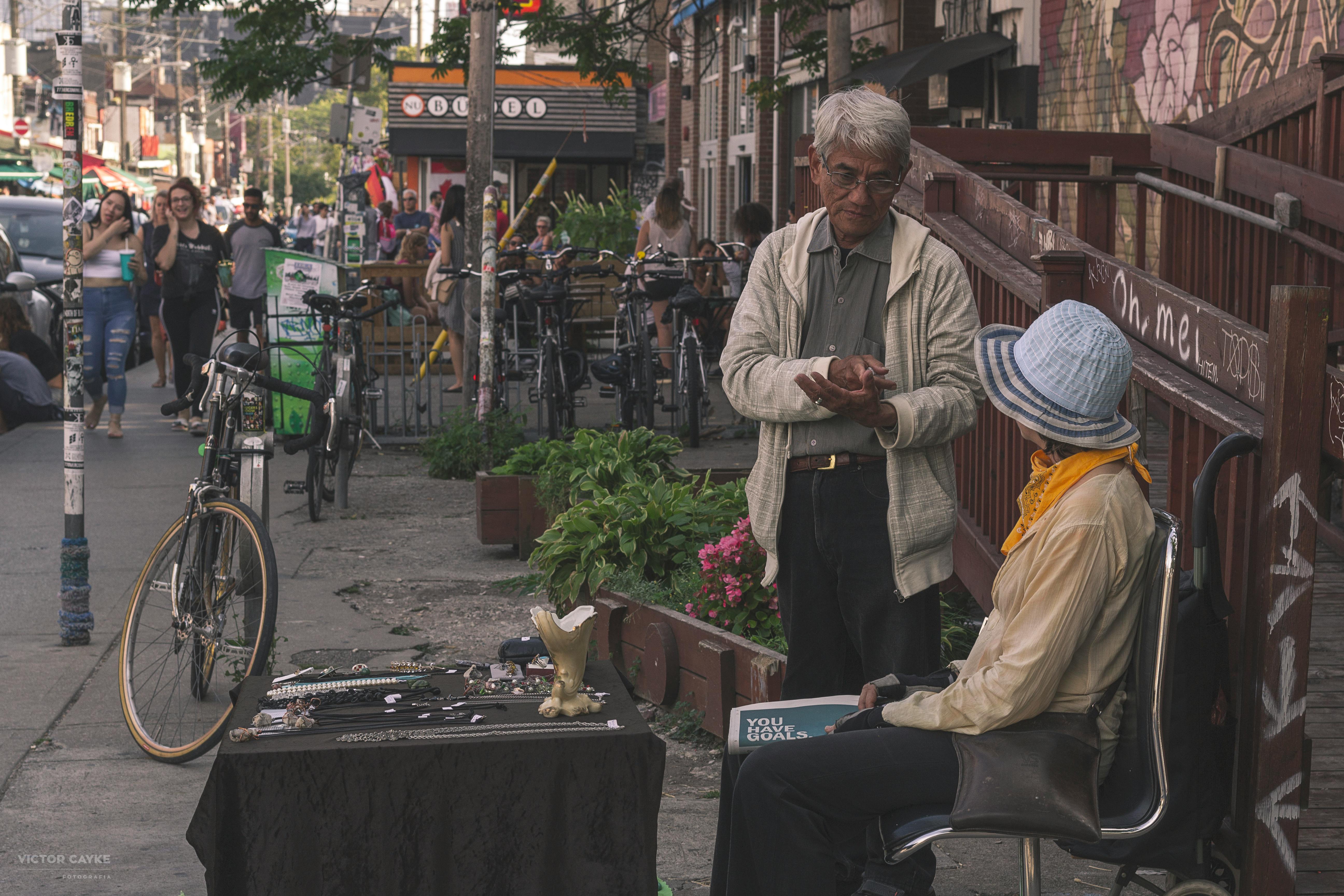 Elderly People Selling Items on a Street Market Stall · Free Stock Photo