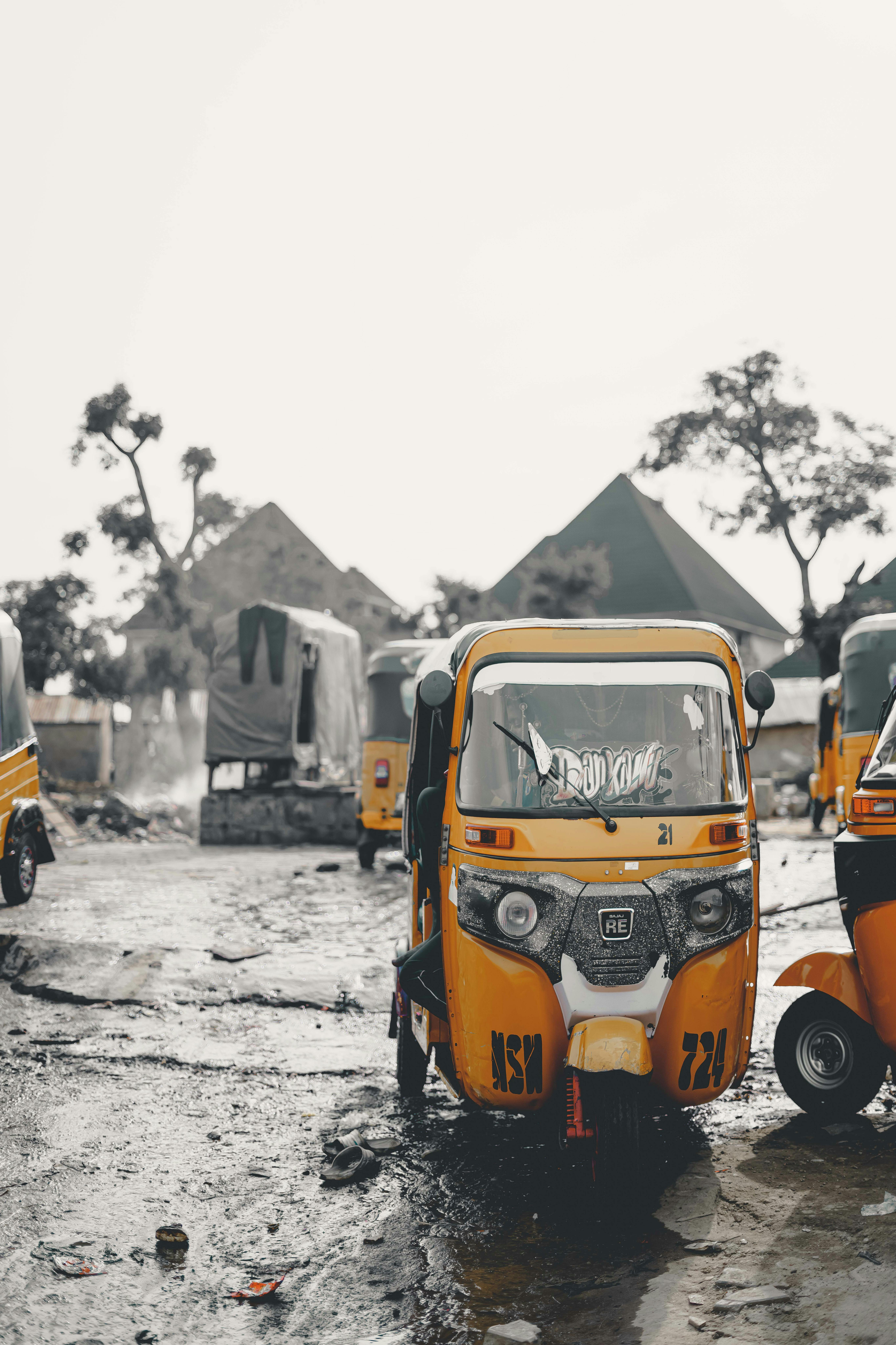 Yellow Auto Rickshaws Parked on a Street · Free Stock Photo