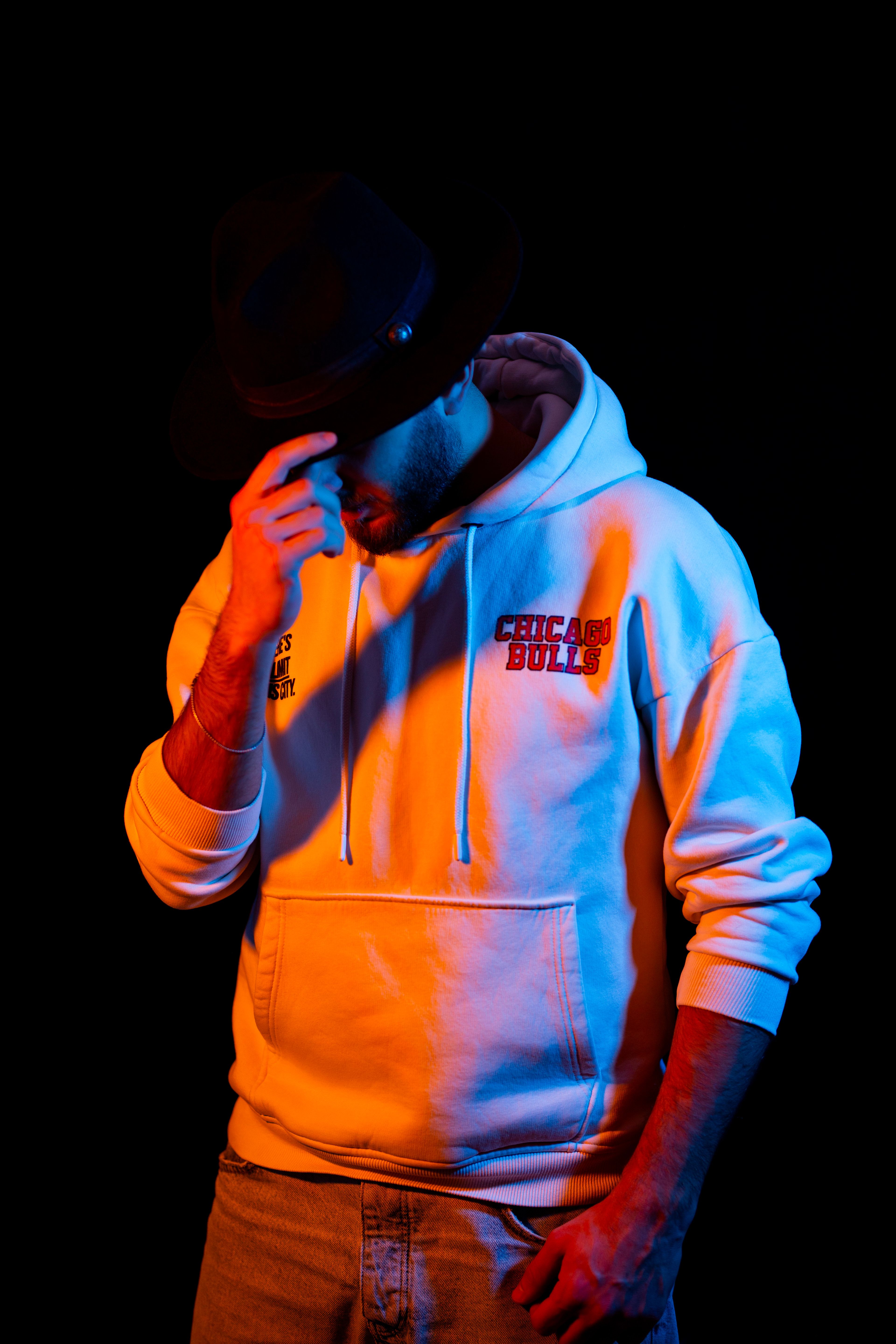Studio Portrait of a Male Model Wearing a White Hoodie · Free Stock Photo