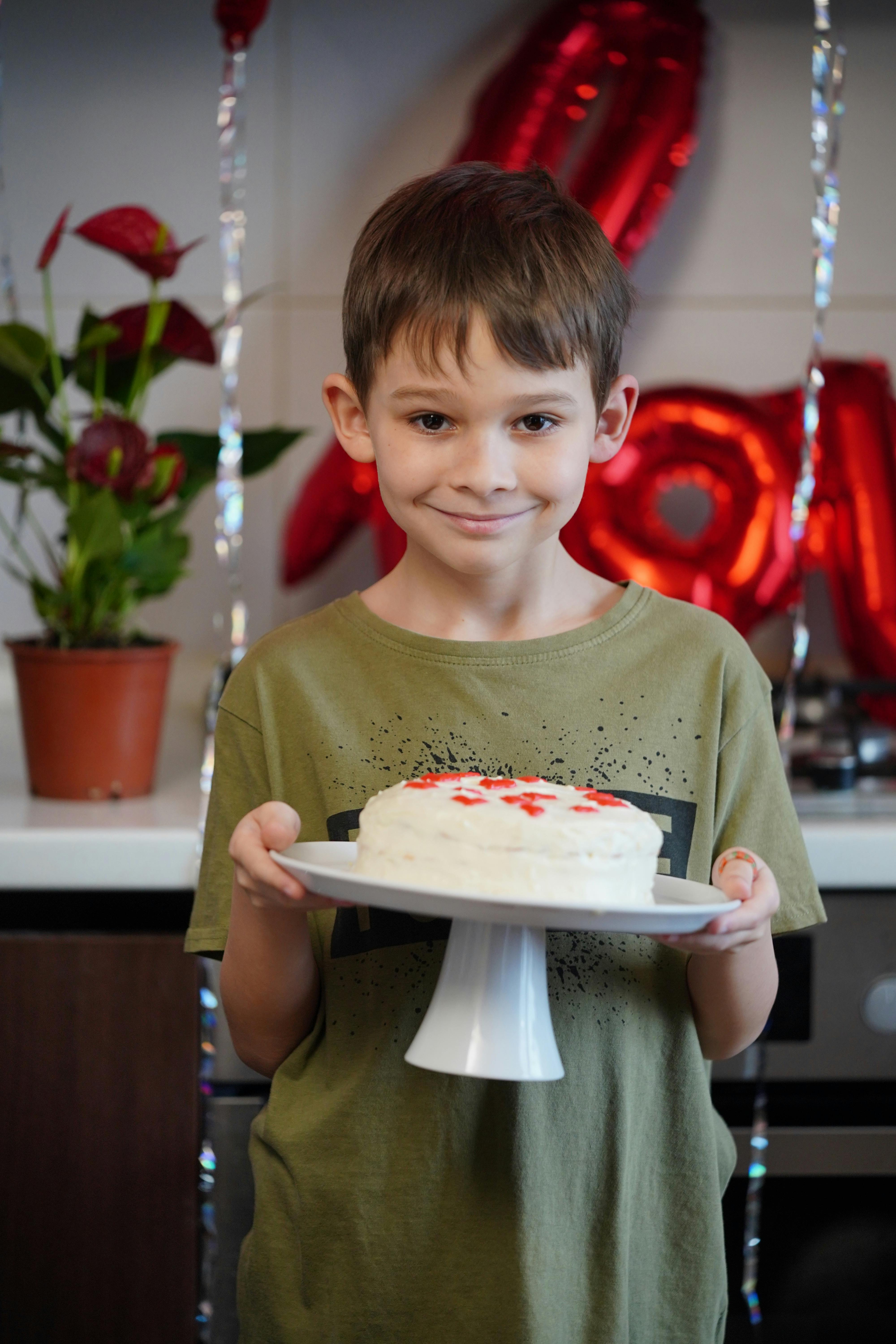 Little Boy Holding a Cake · Free Stock Photo