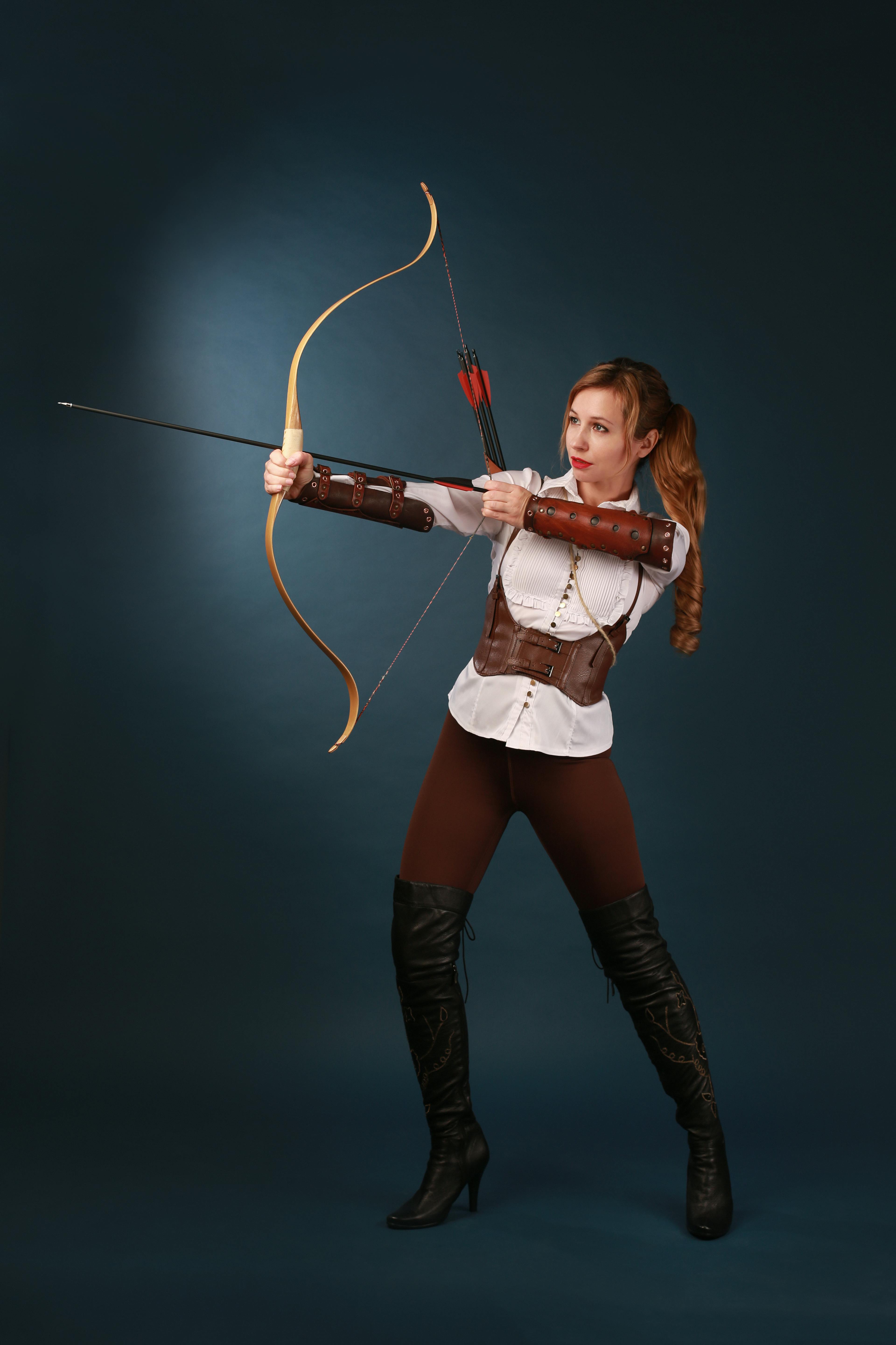 Archer Aiming a Bow · Free Stock Photo