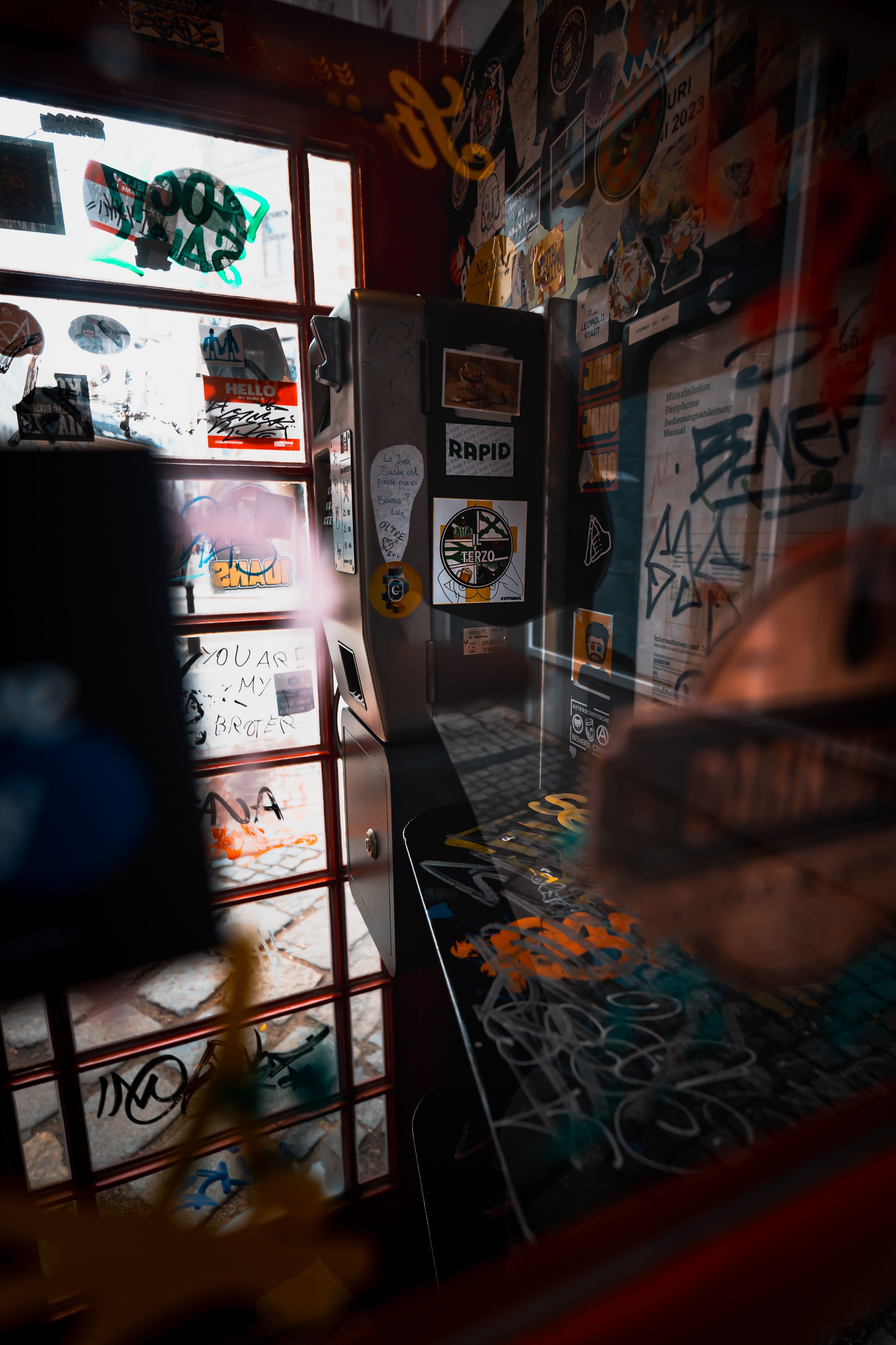 Stickers and Graffiti in Telephone Booth · Free Stock Photo