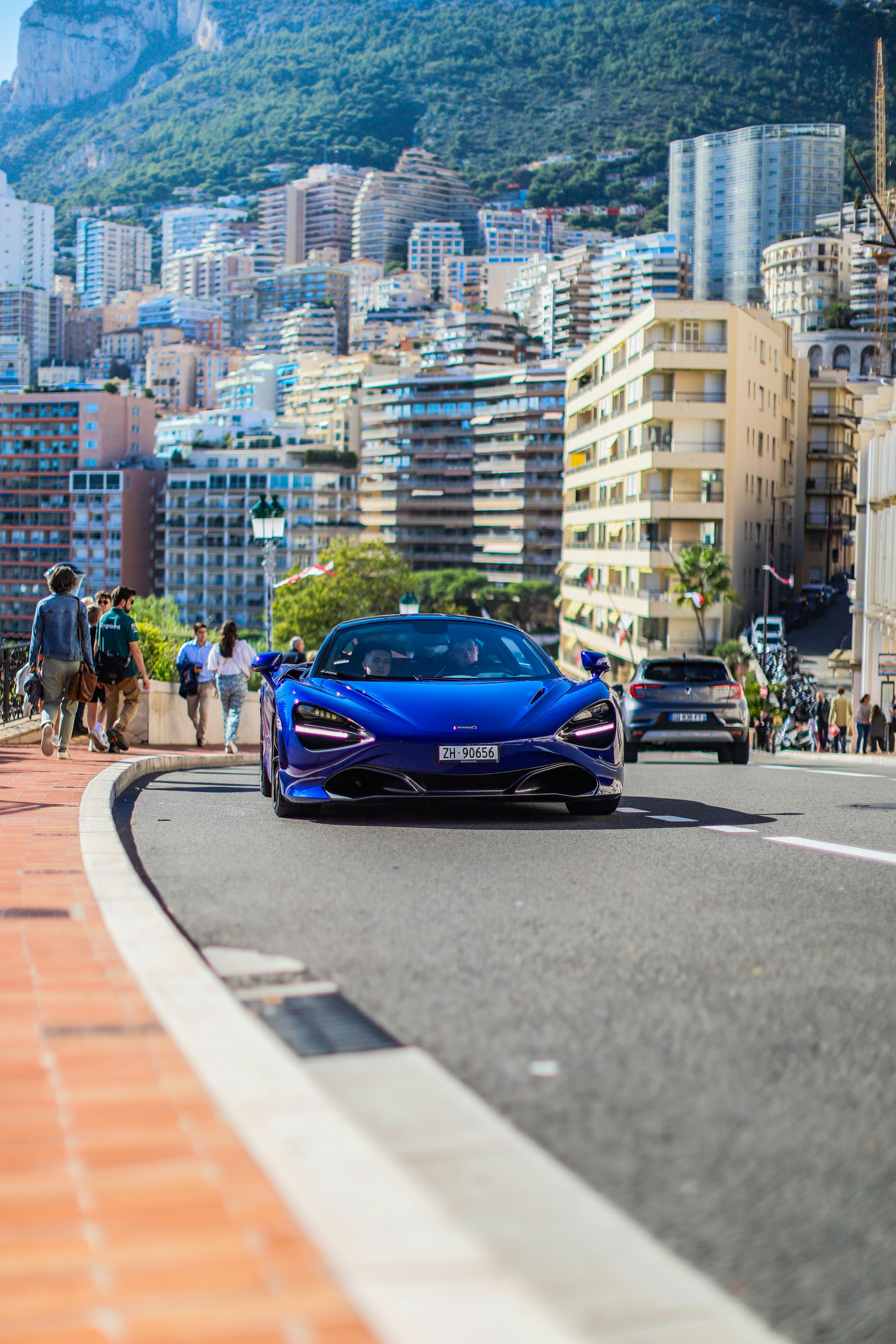 A Blue Car on the Road · Free Stock Photo