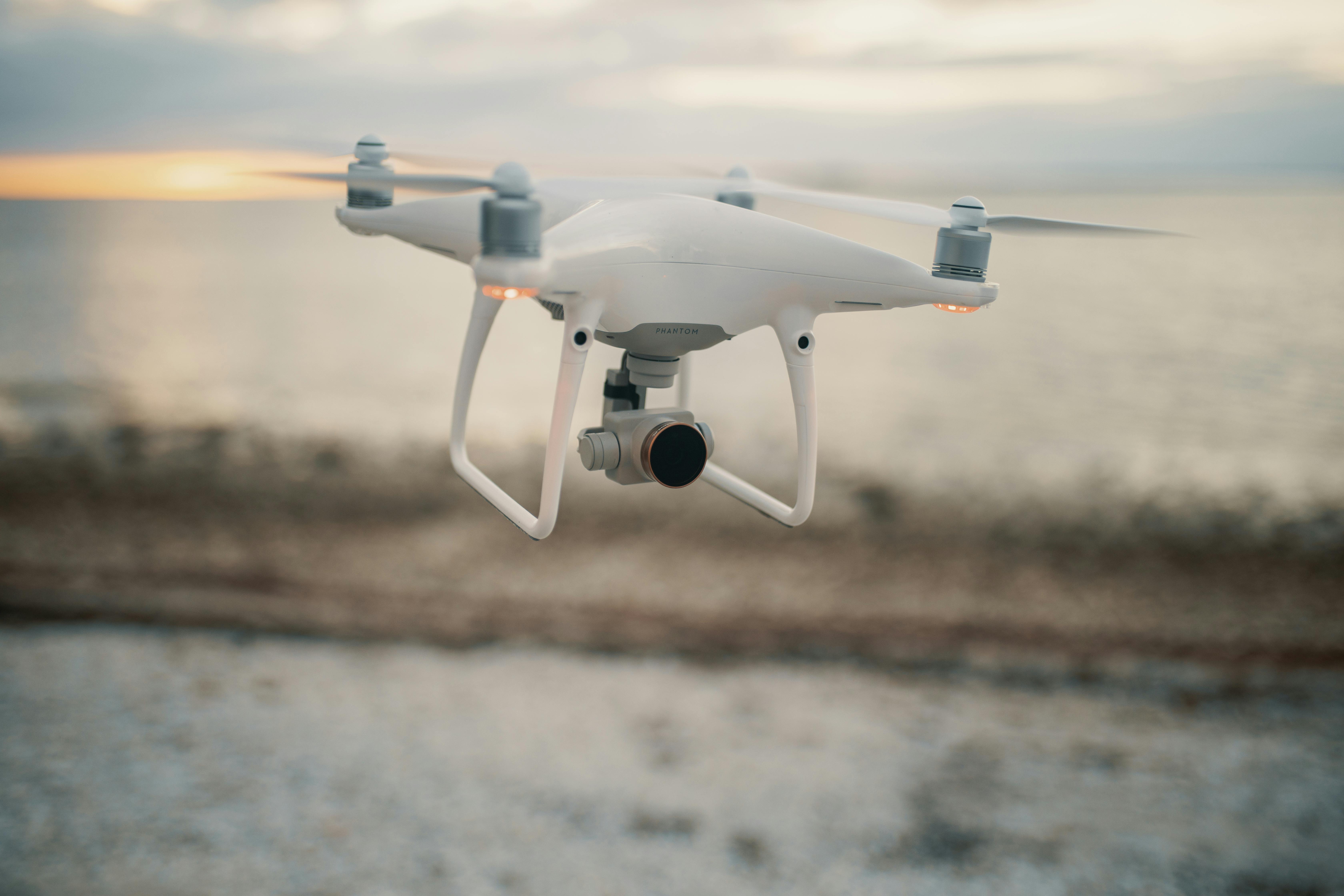 Flying White Quadcopter Drone · Free Stock Photo