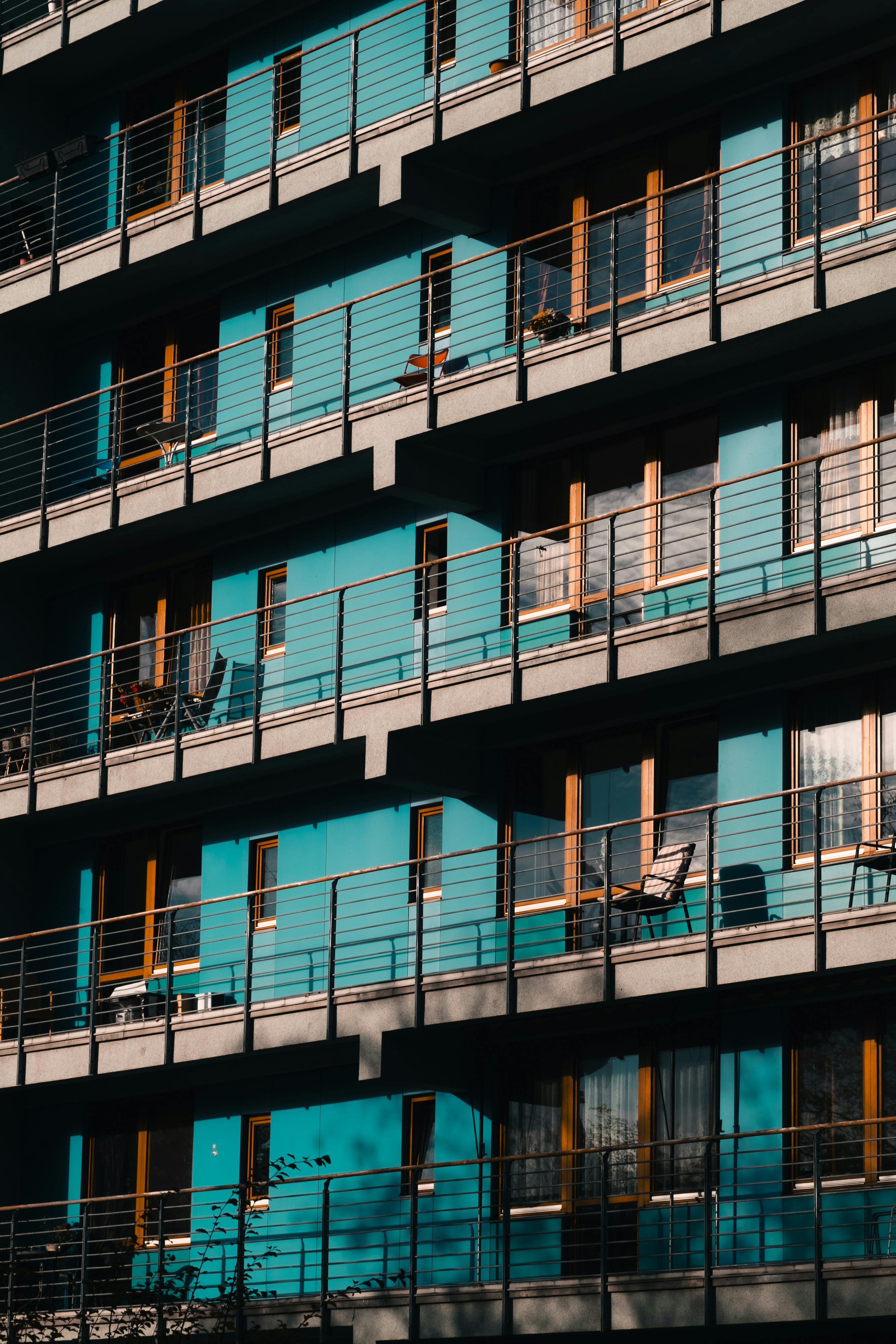 Facade of a Blue Apartment Building in City · Free Stock Photo