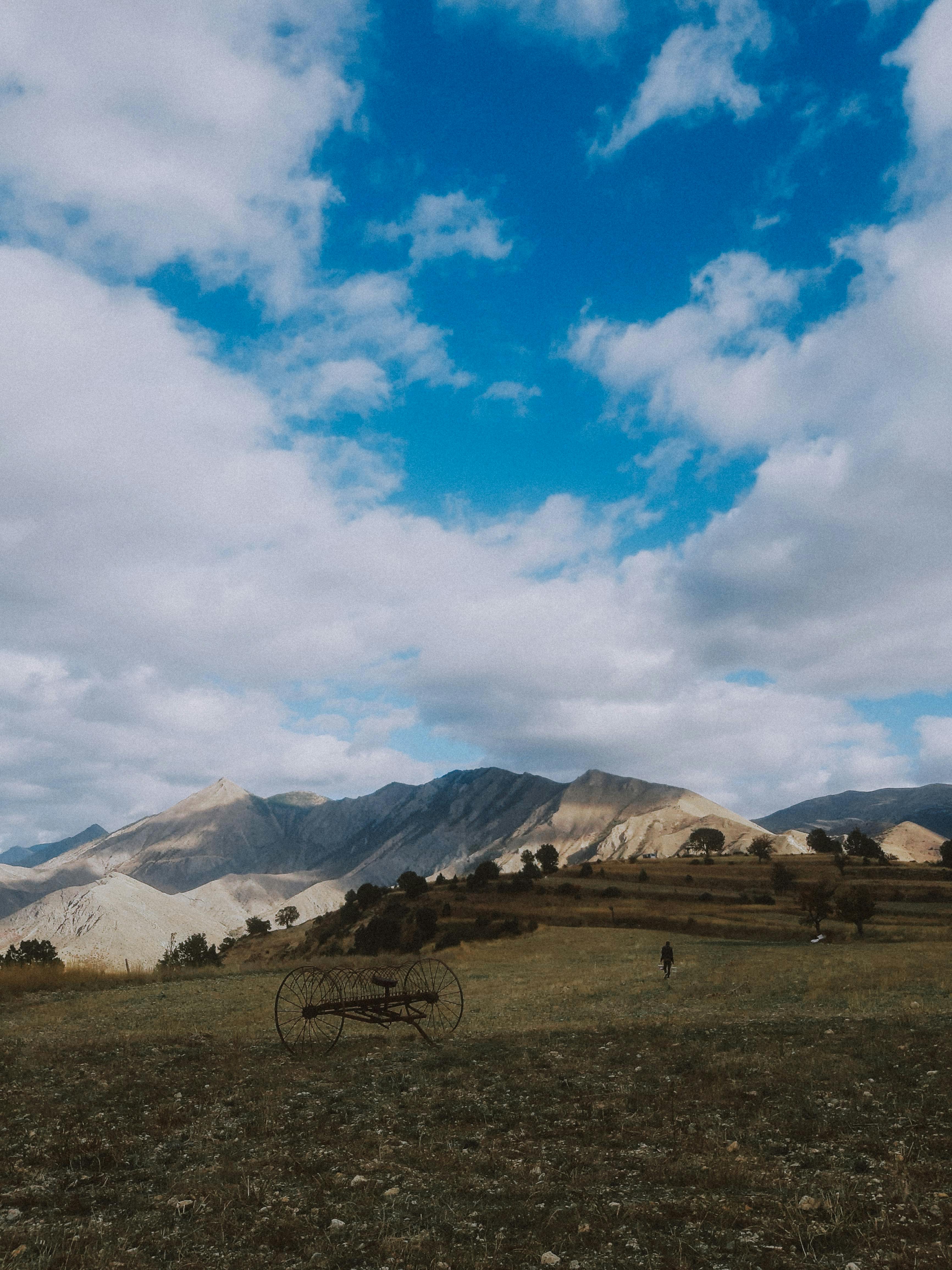 Brown Field With Trees over Mountain · Free Stock Photo