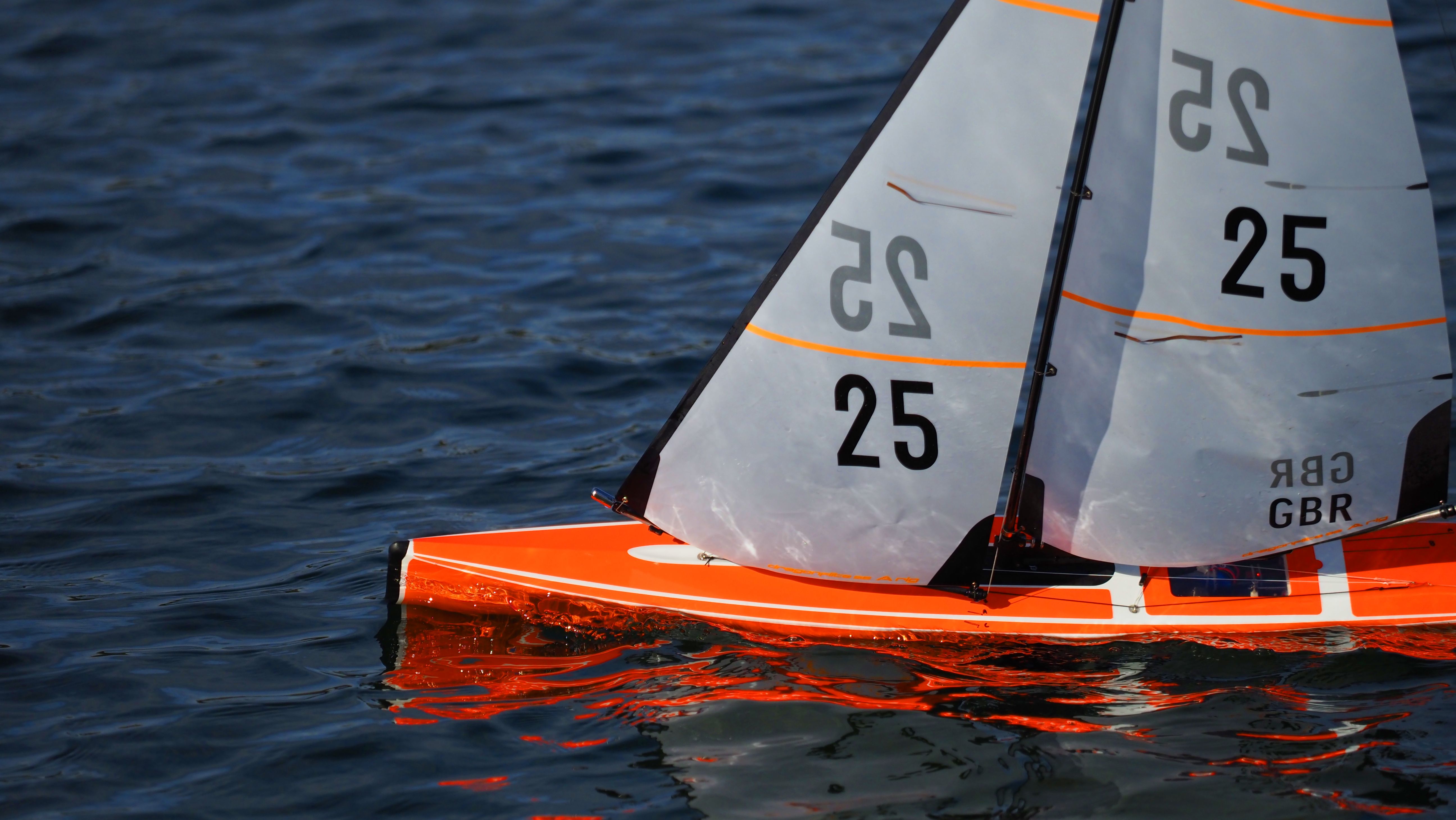 Orange colored model yacht · Free Stock Photo