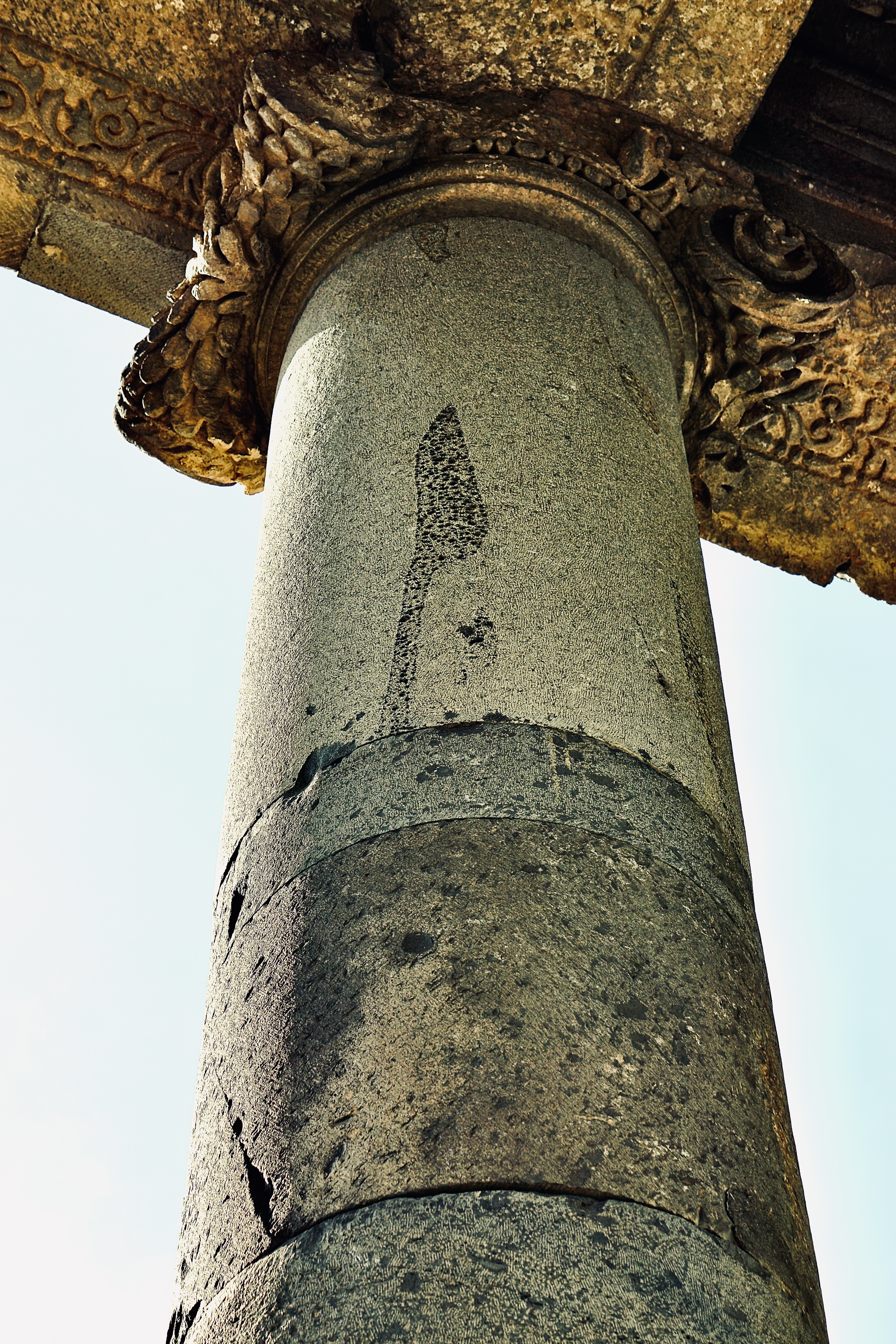 A close up of a pillar with a carved stone · Free Stock Photo