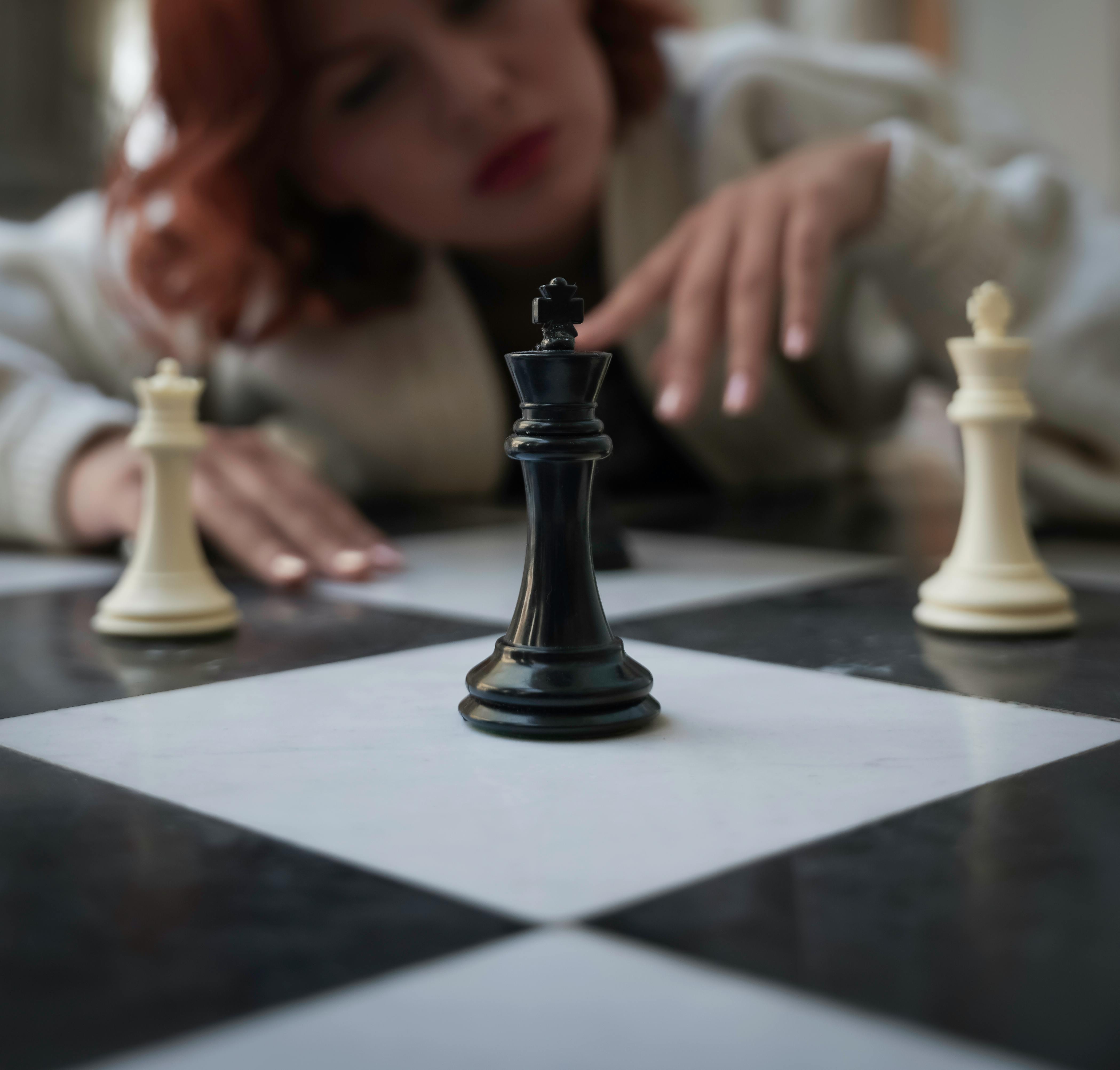 Woman Lying Down with Chess Pieces on Floor · Free Stock Photo