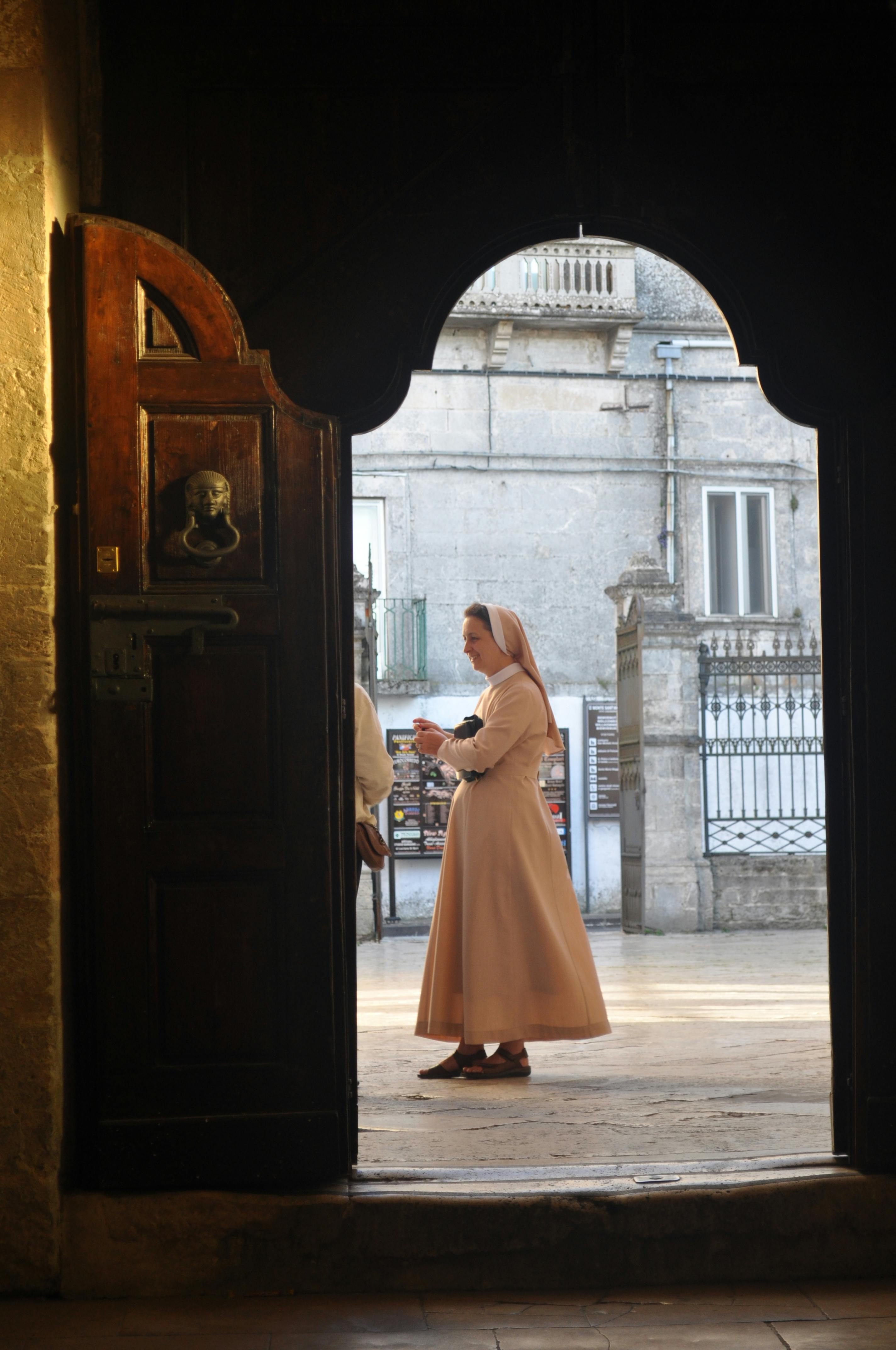 A Nun Standing Outdoors · Free Stock Photo