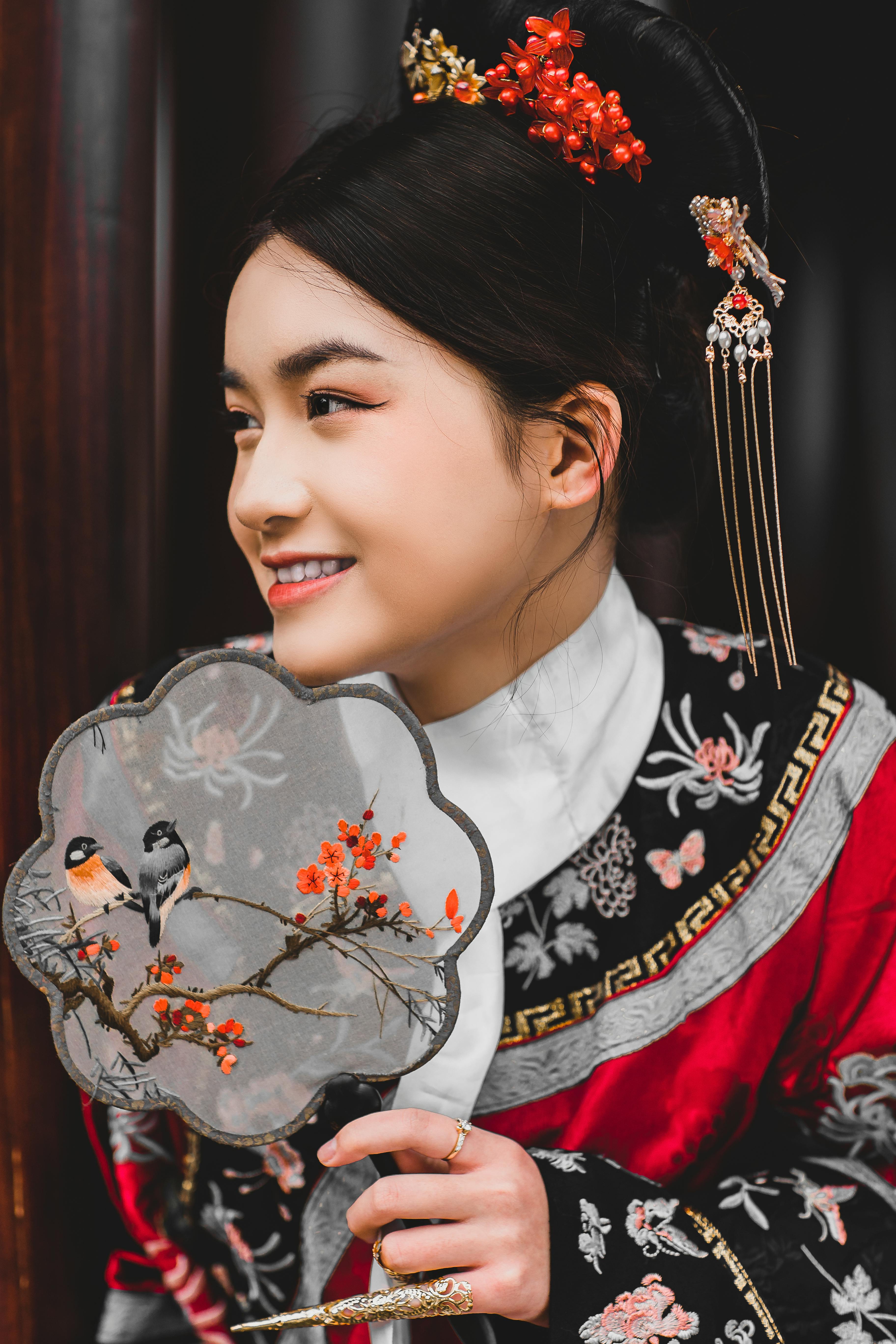 Women in Traditional Clothing and with Fan · Free Stock Photo