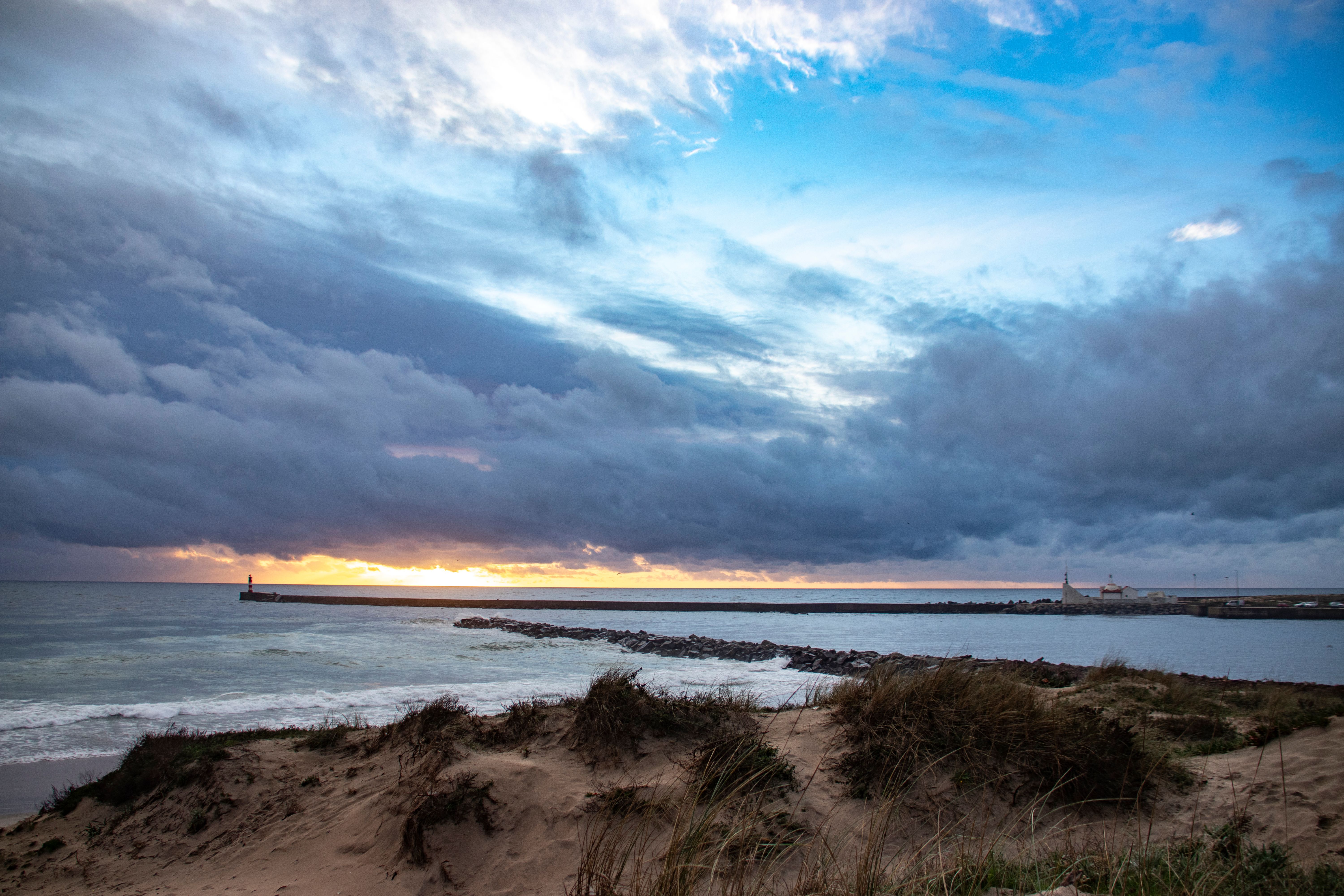 Breakwaters on the Sea at Sunrise · Free Stock Photo
