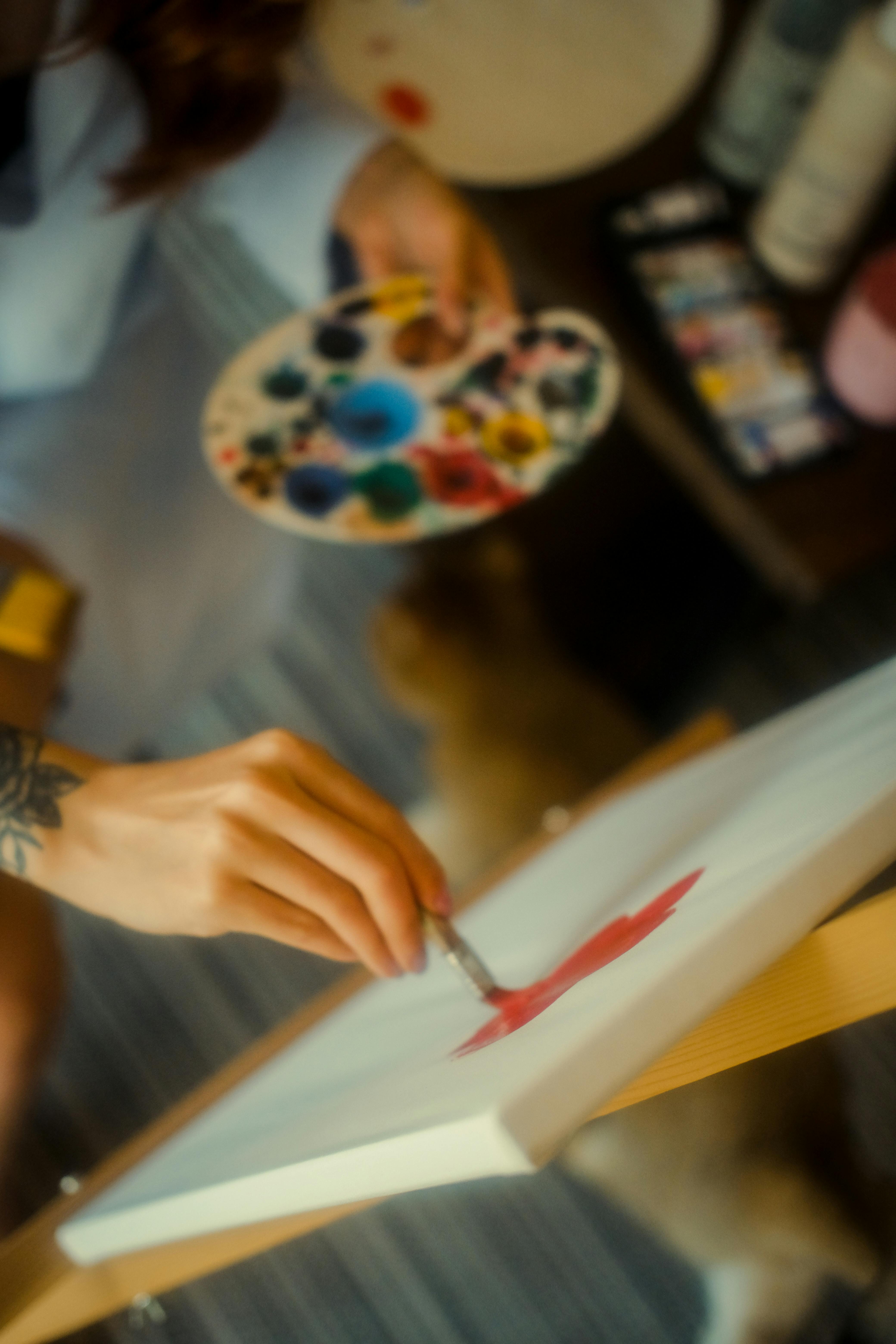 Hand Painting with Paintbrush · Free Stock Photo