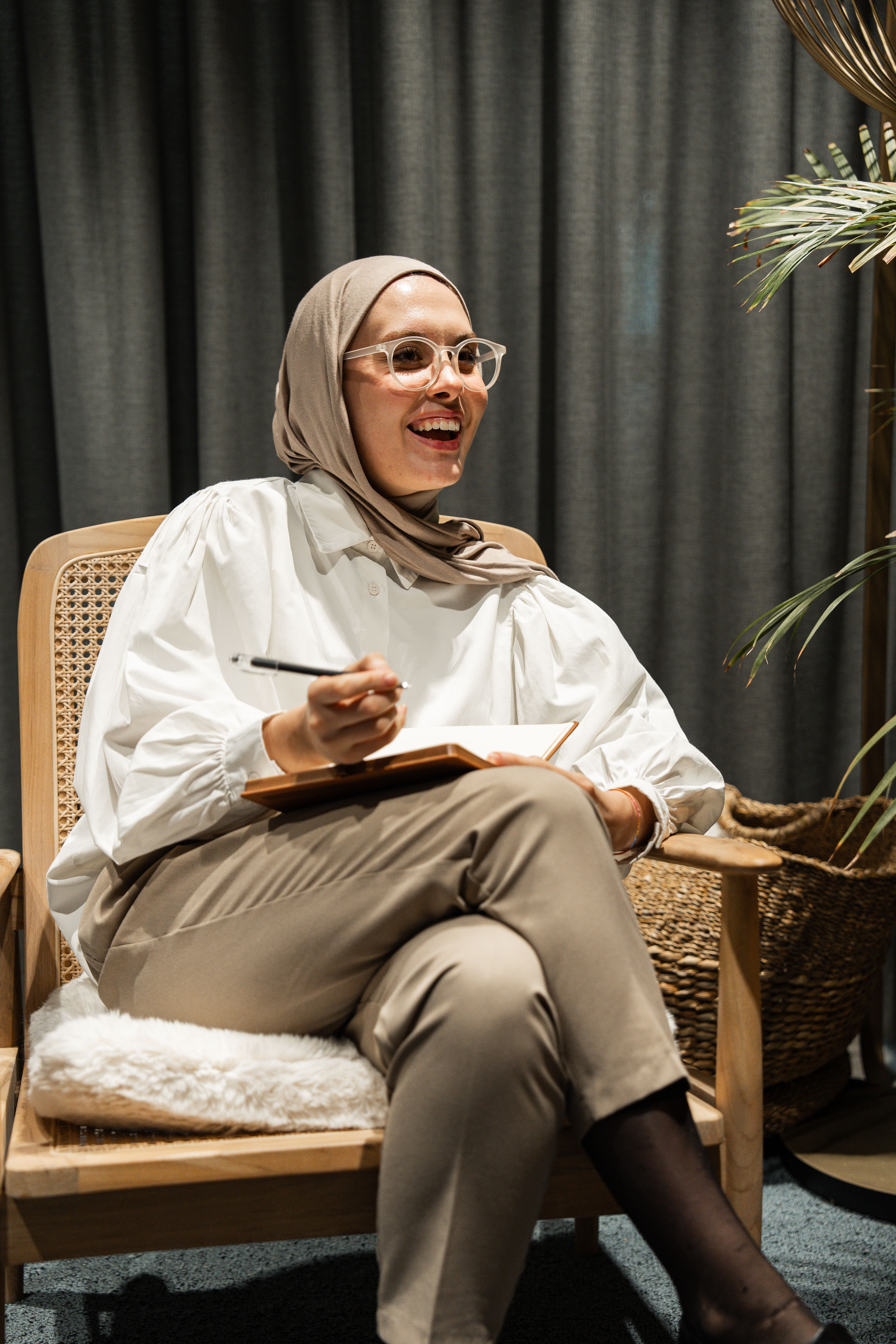 Woman in Hijab Sitting on a Chair · Free Stock Photo