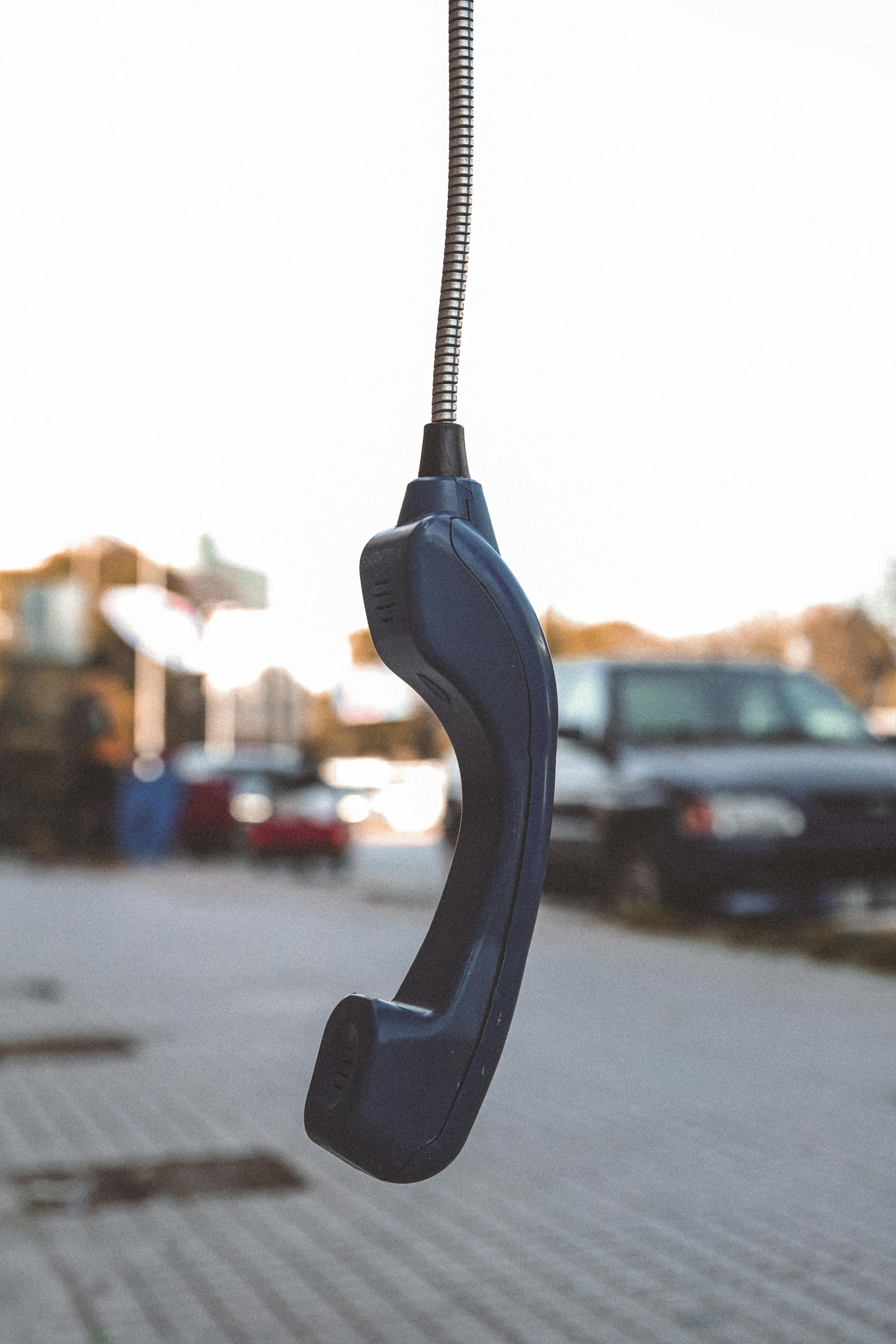 Telephone Hanging From the Line · Free Stock Photo