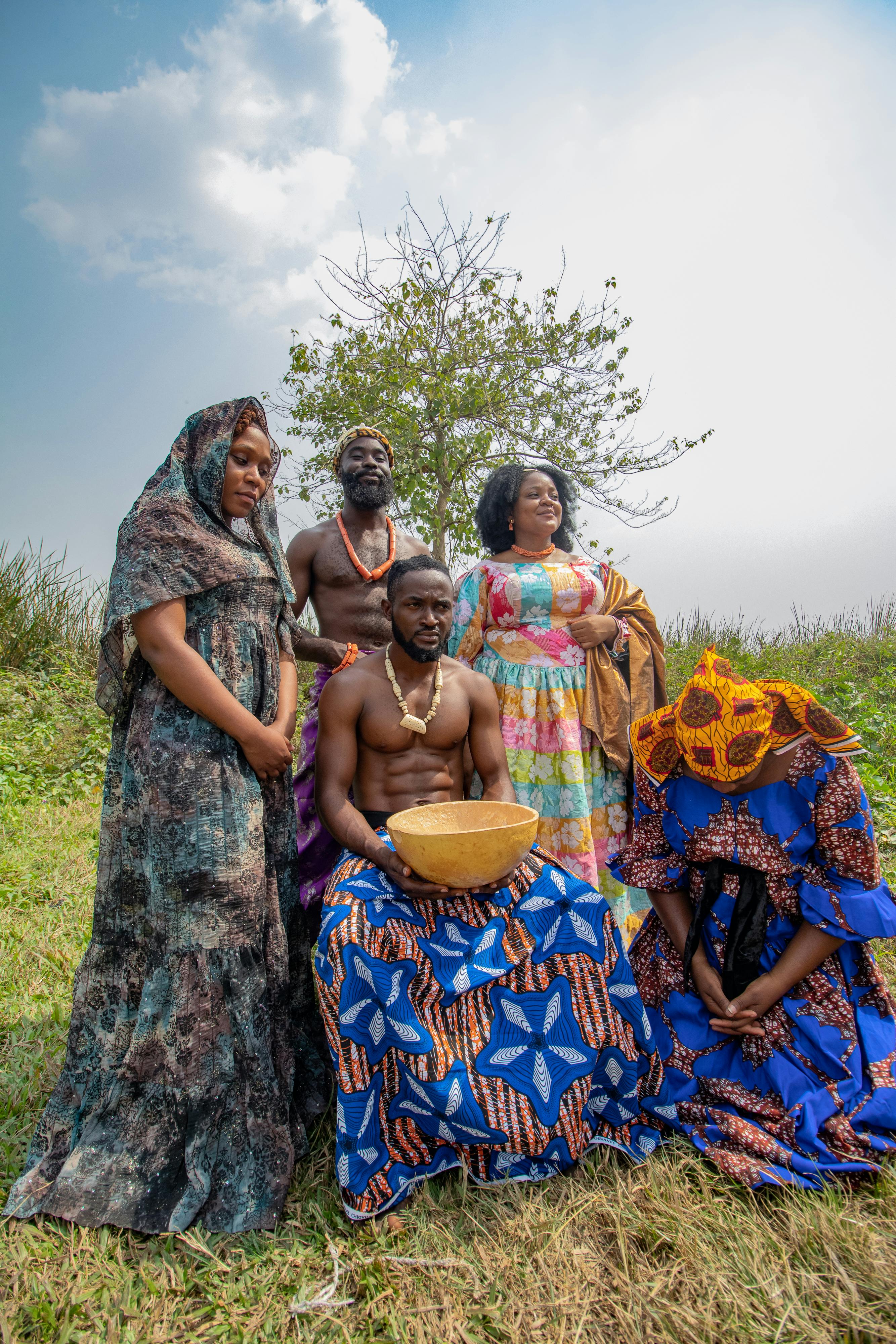 Women and Men Sitting in Traditional Clothing in Countryside · Free ...