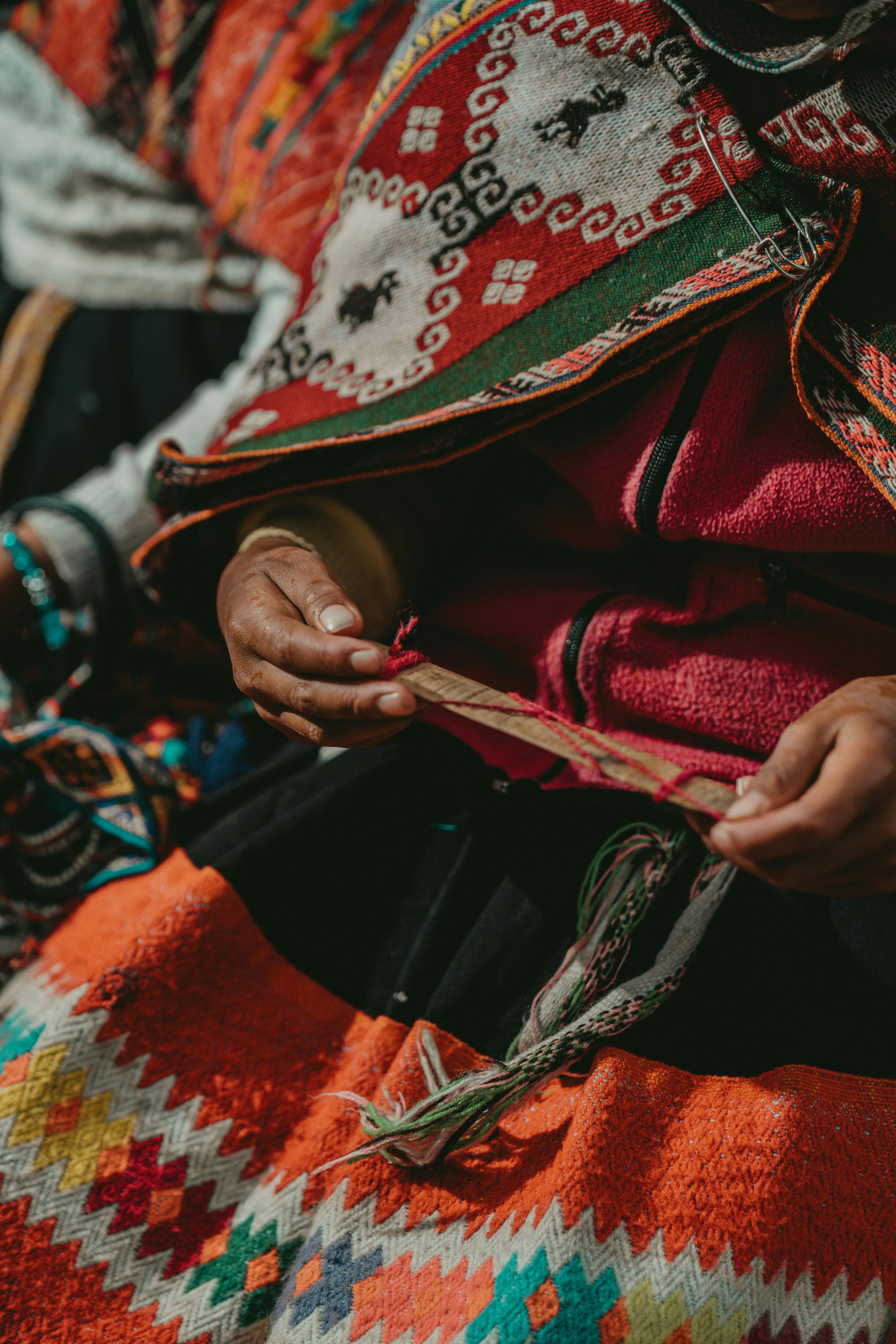 Closeup of Women Wearing Traditional Woven Clothing · Free Stock Photo