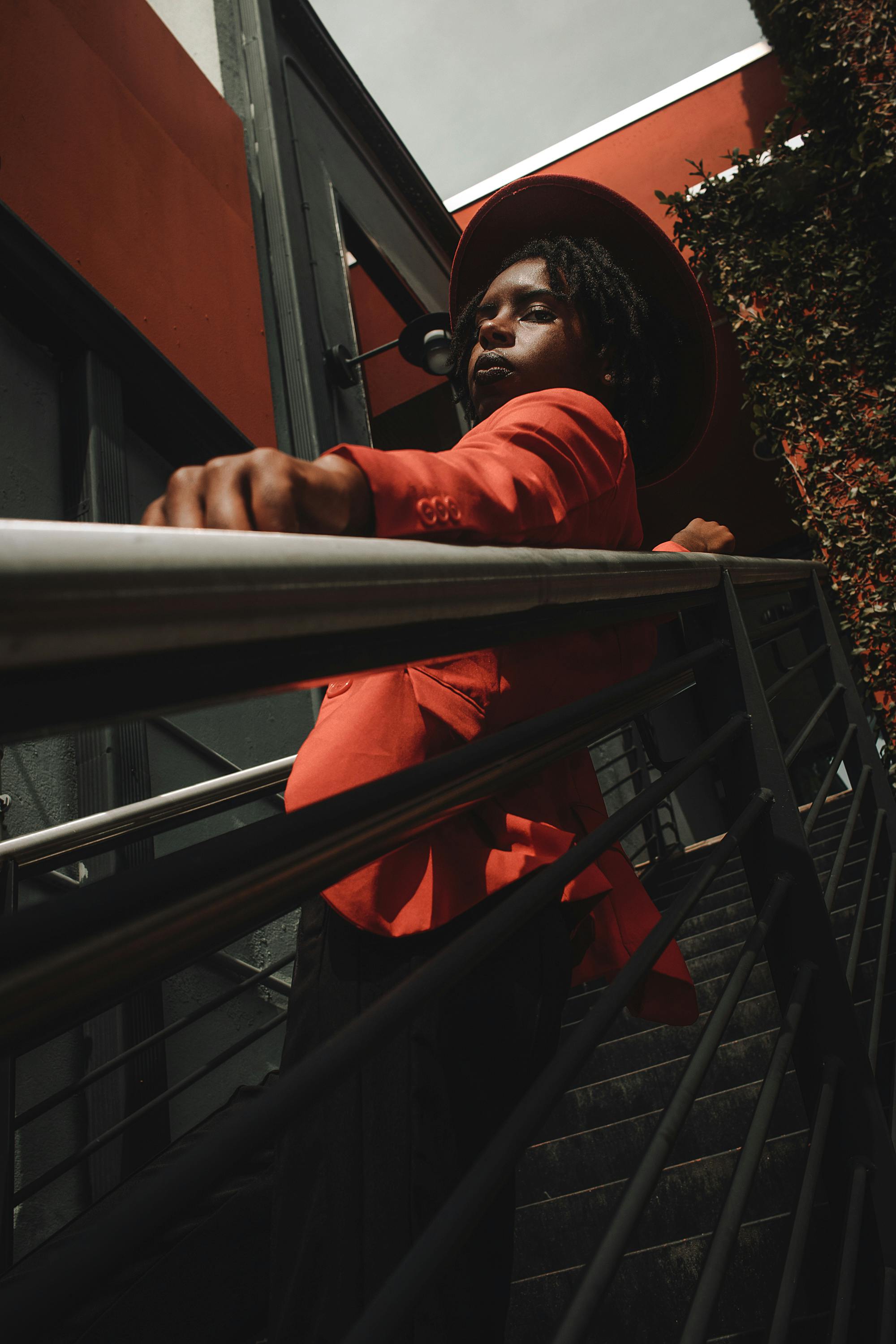 Person Leaning on Railing · Free Stock Photo