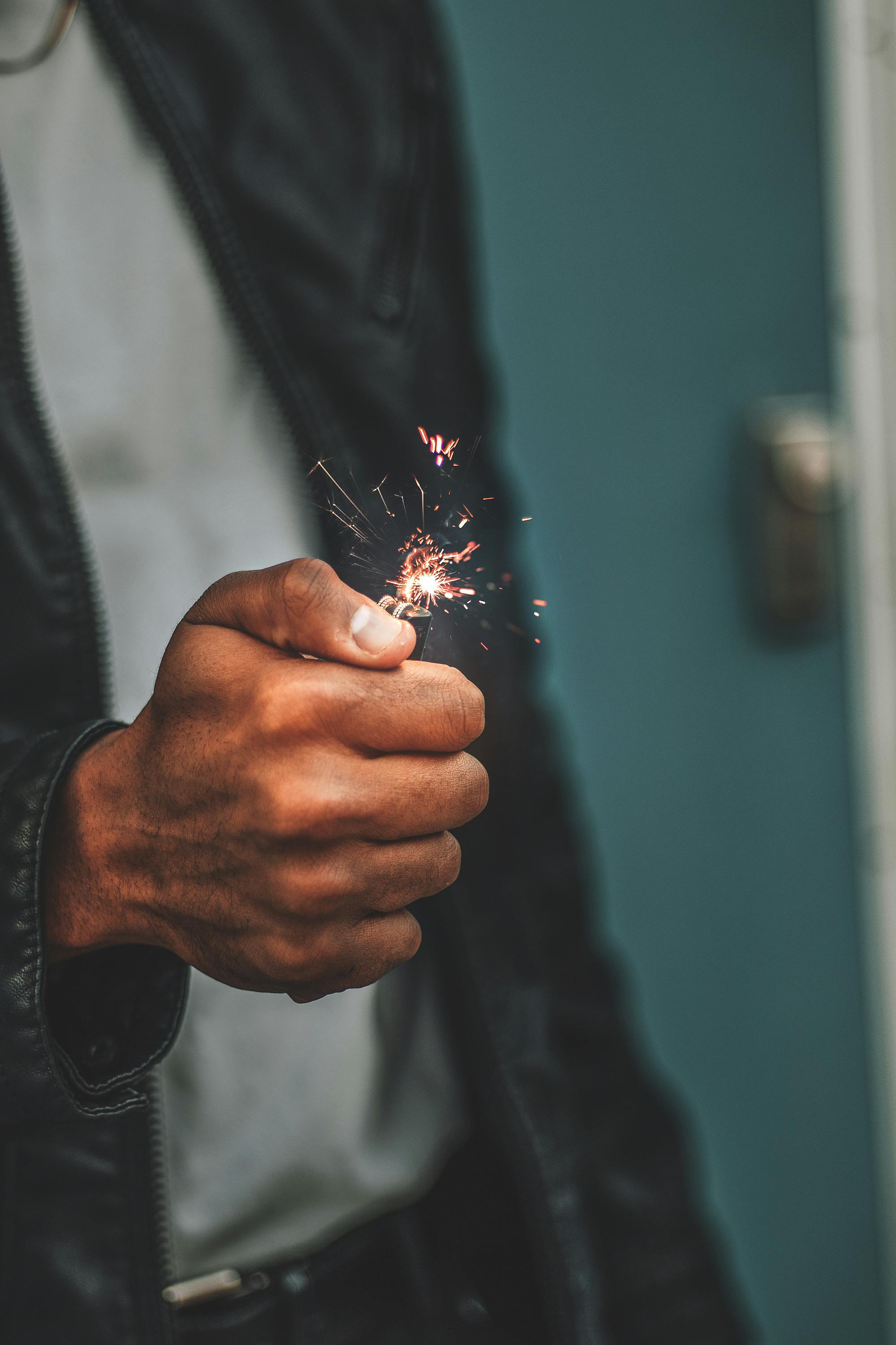 Man Hand Holding Lighter · Free Stock Photo