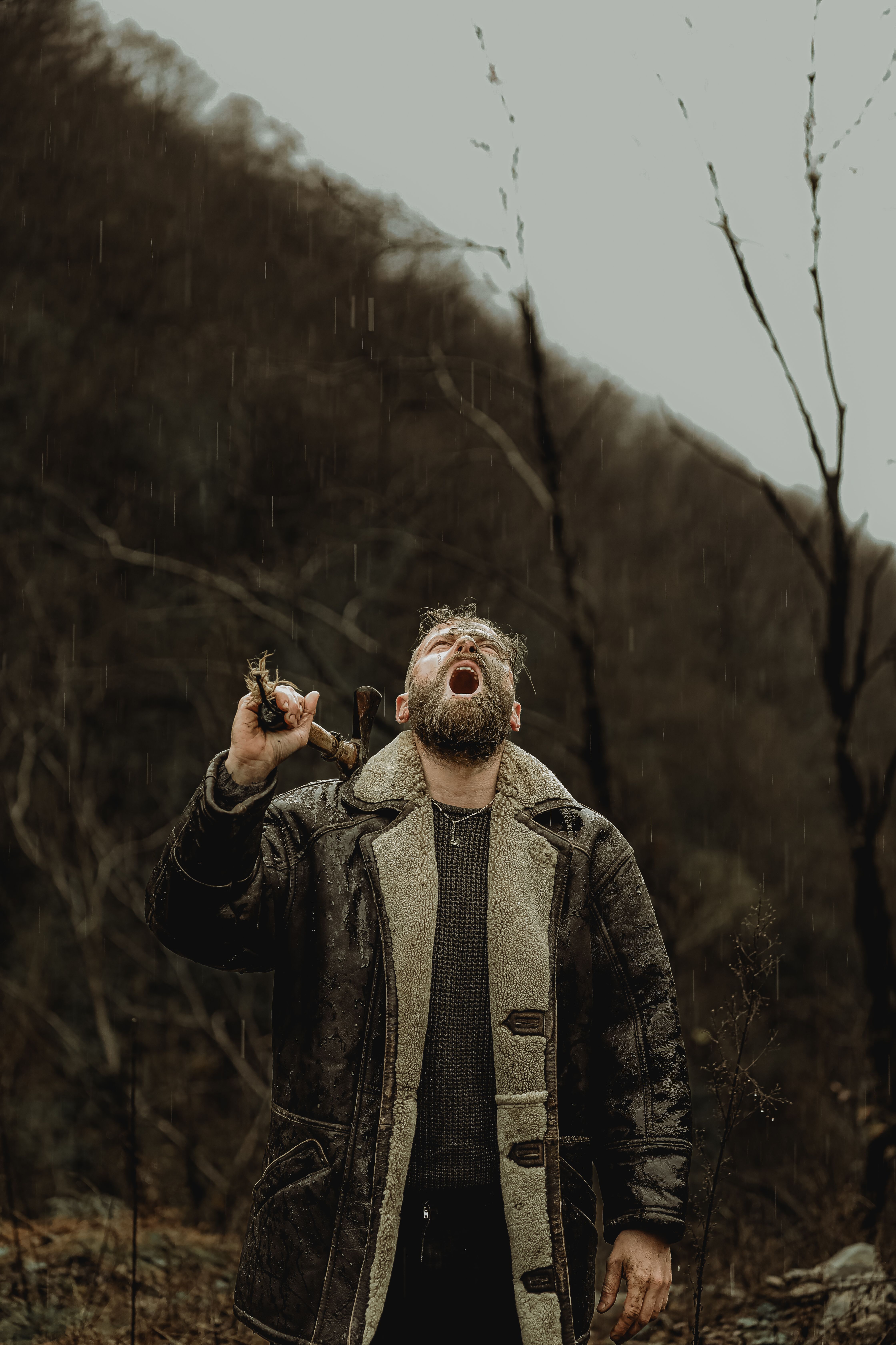 Man in Jacket and wtih Axe Screaming in Forest · Free Stock Photo
