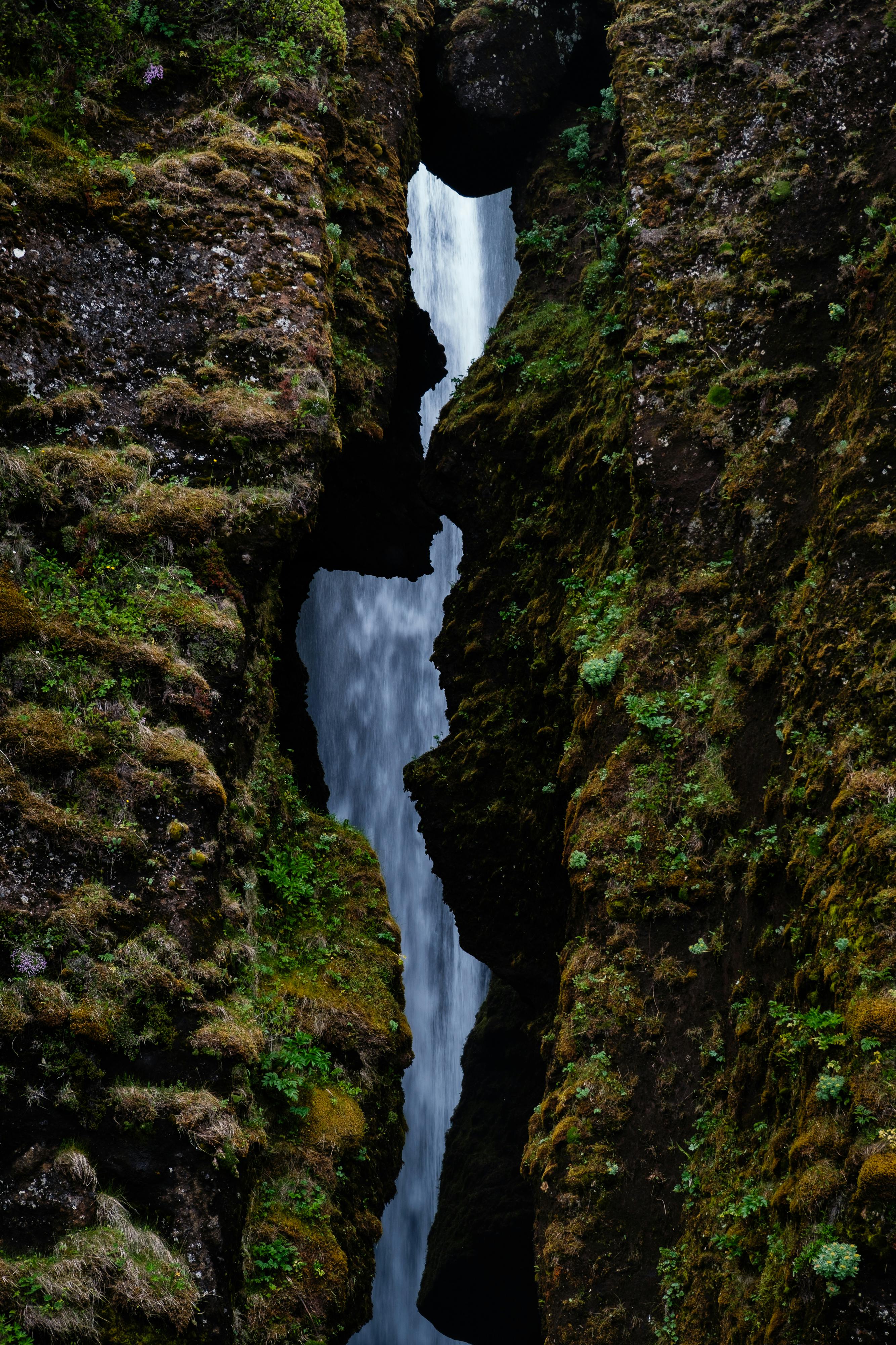 A Waterfall Between Two Rocks · Free Stock Photo