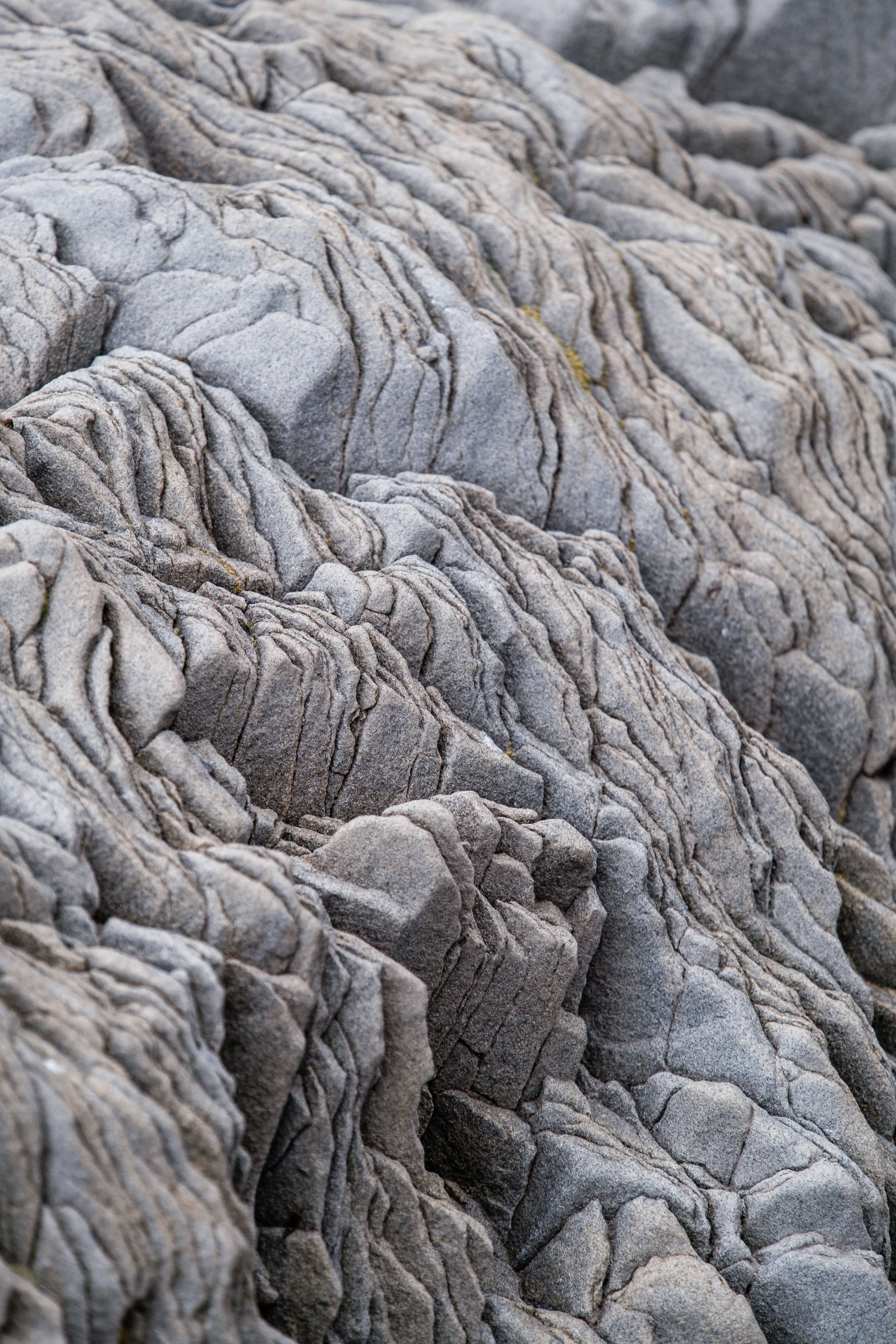A close up of a rock formation with white lines · Free Stock Photo