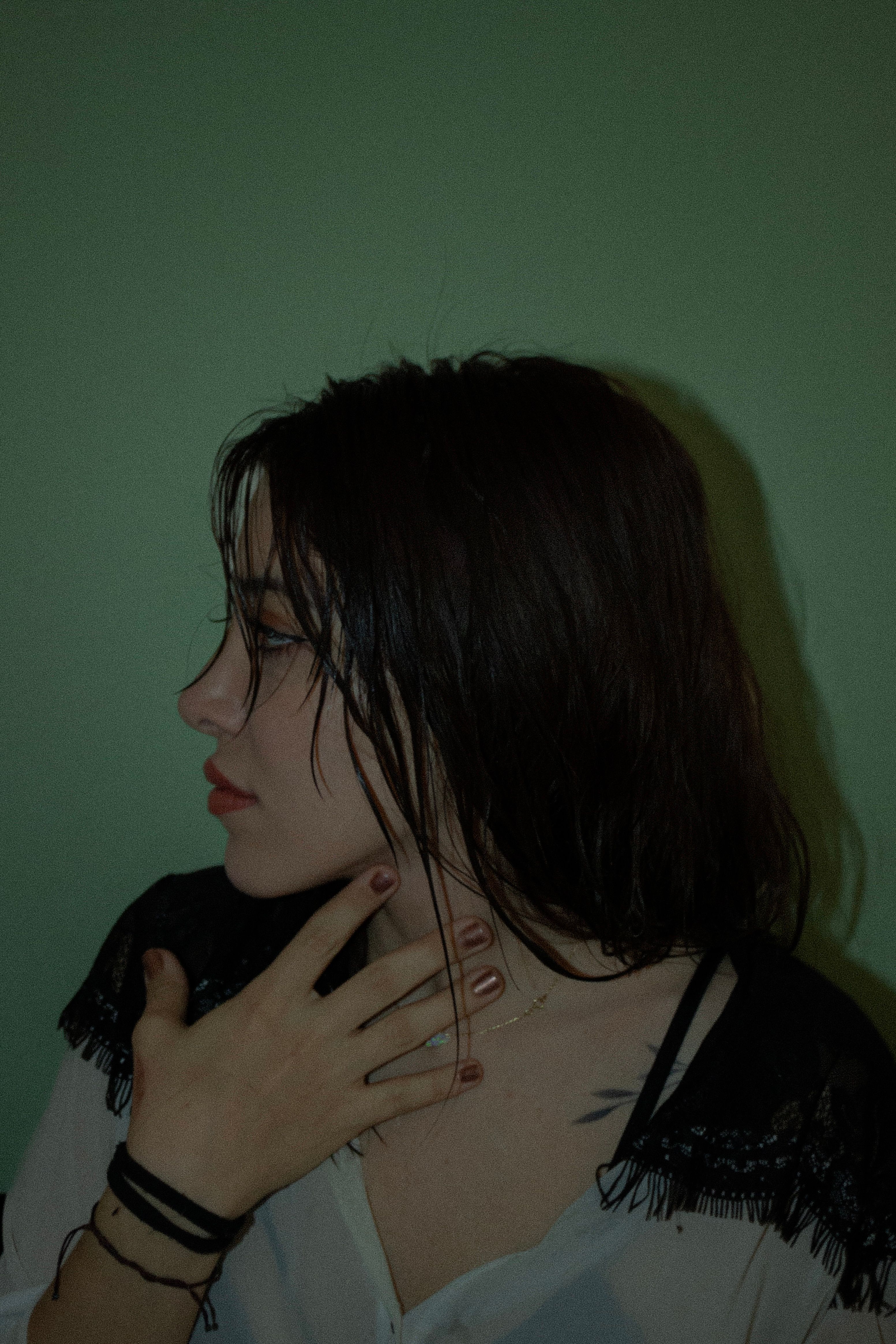 Portrait of Woman with Hand on Neck · Free Stock Photo