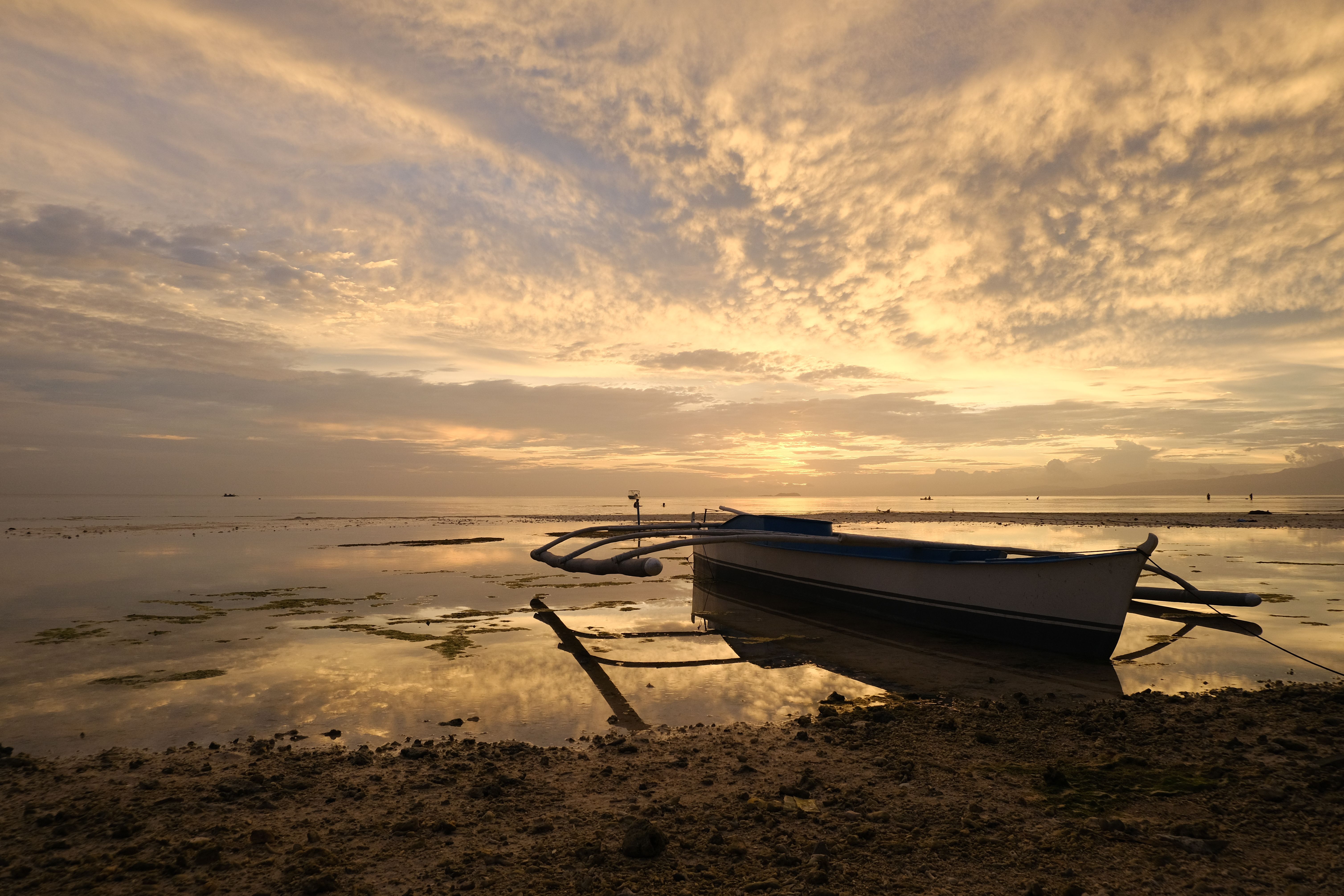 Fishing Boat on Sea Shore at Sunset · Free Stock Photo
