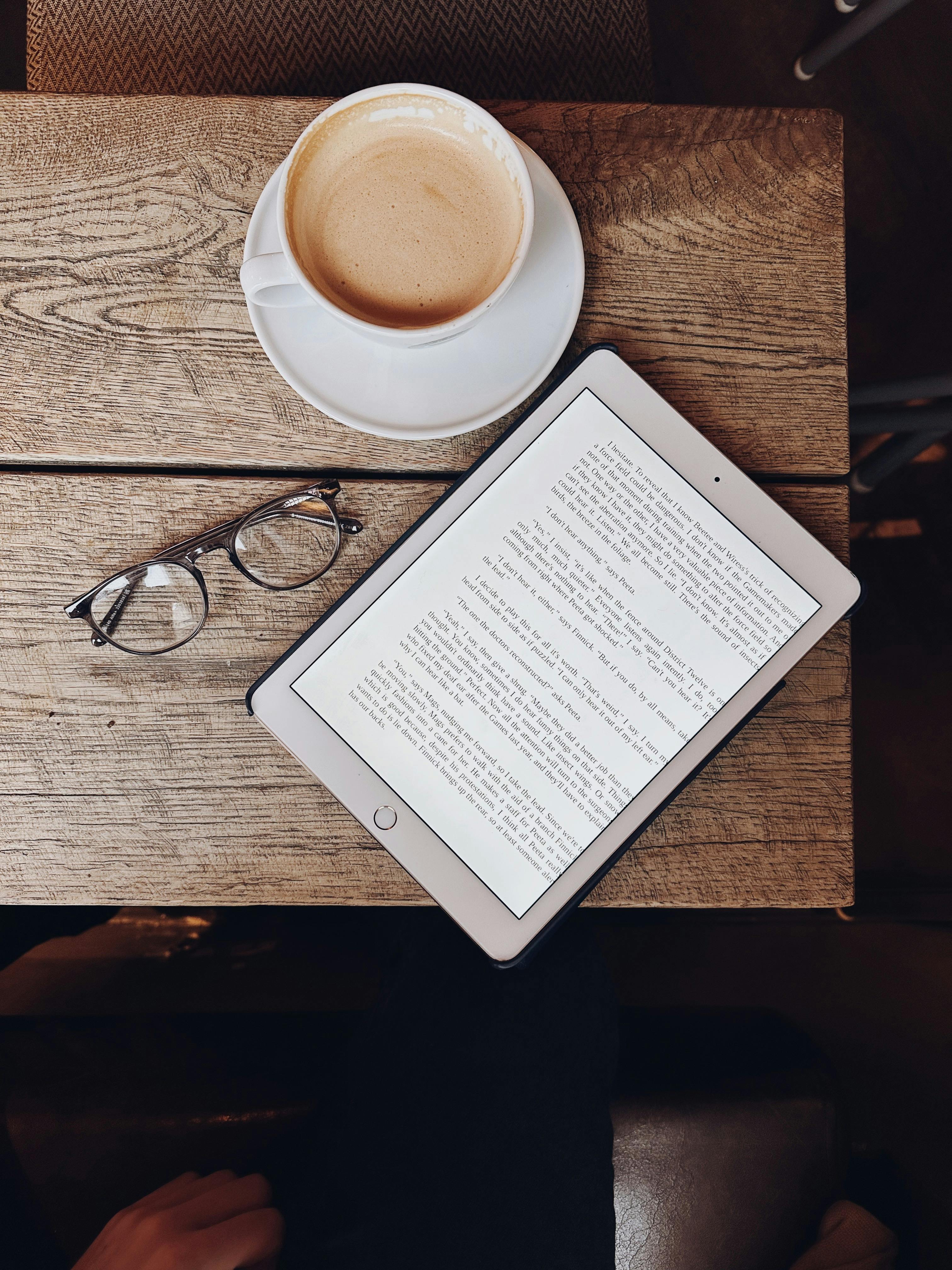 Top View Photo of Coffee Near Tablet · Free Stock Photo