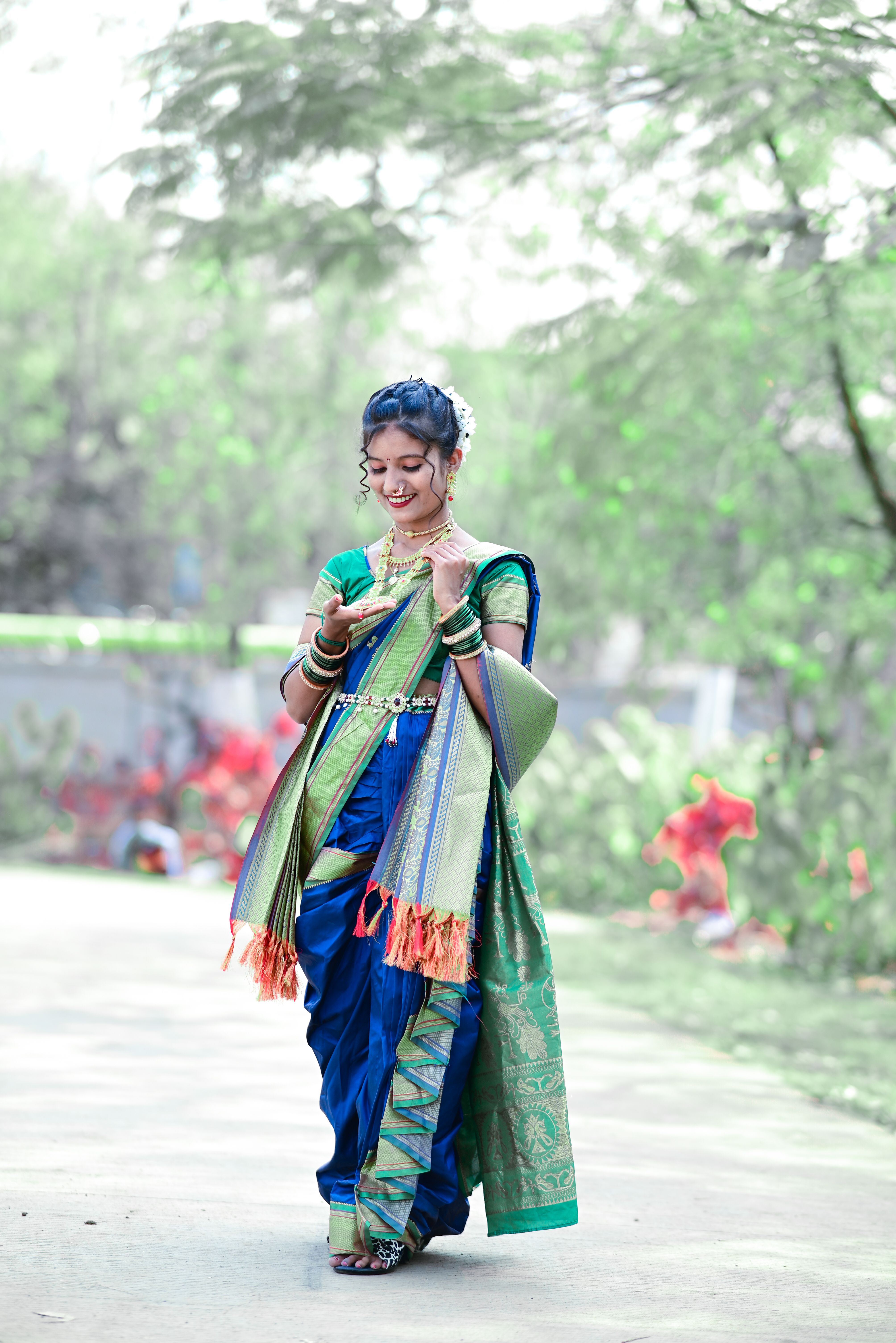 Smiling Woman Walking in Traditional Dress · Free Stock Photo