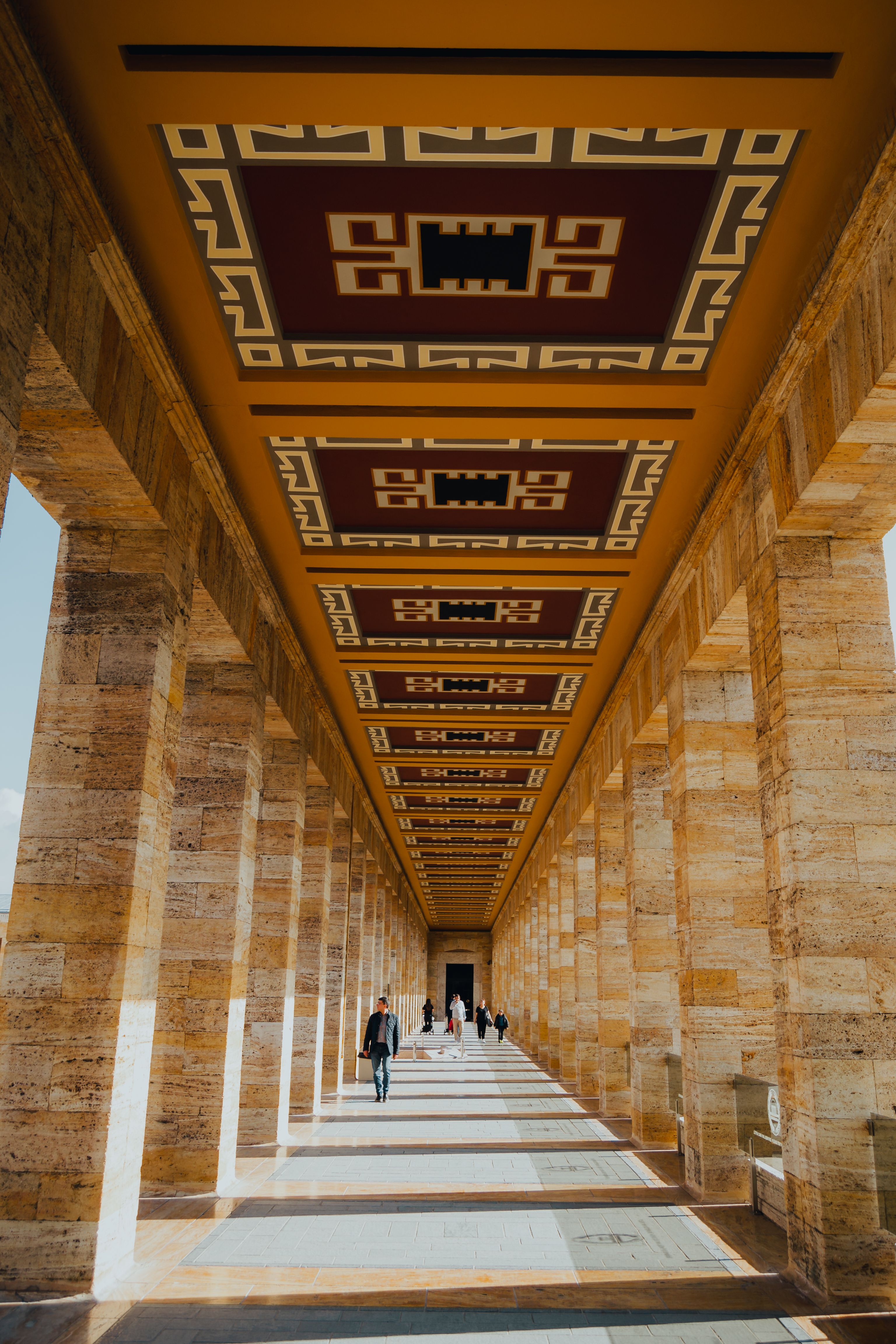 The columns of a building with geometric designs · Free Stock Photo