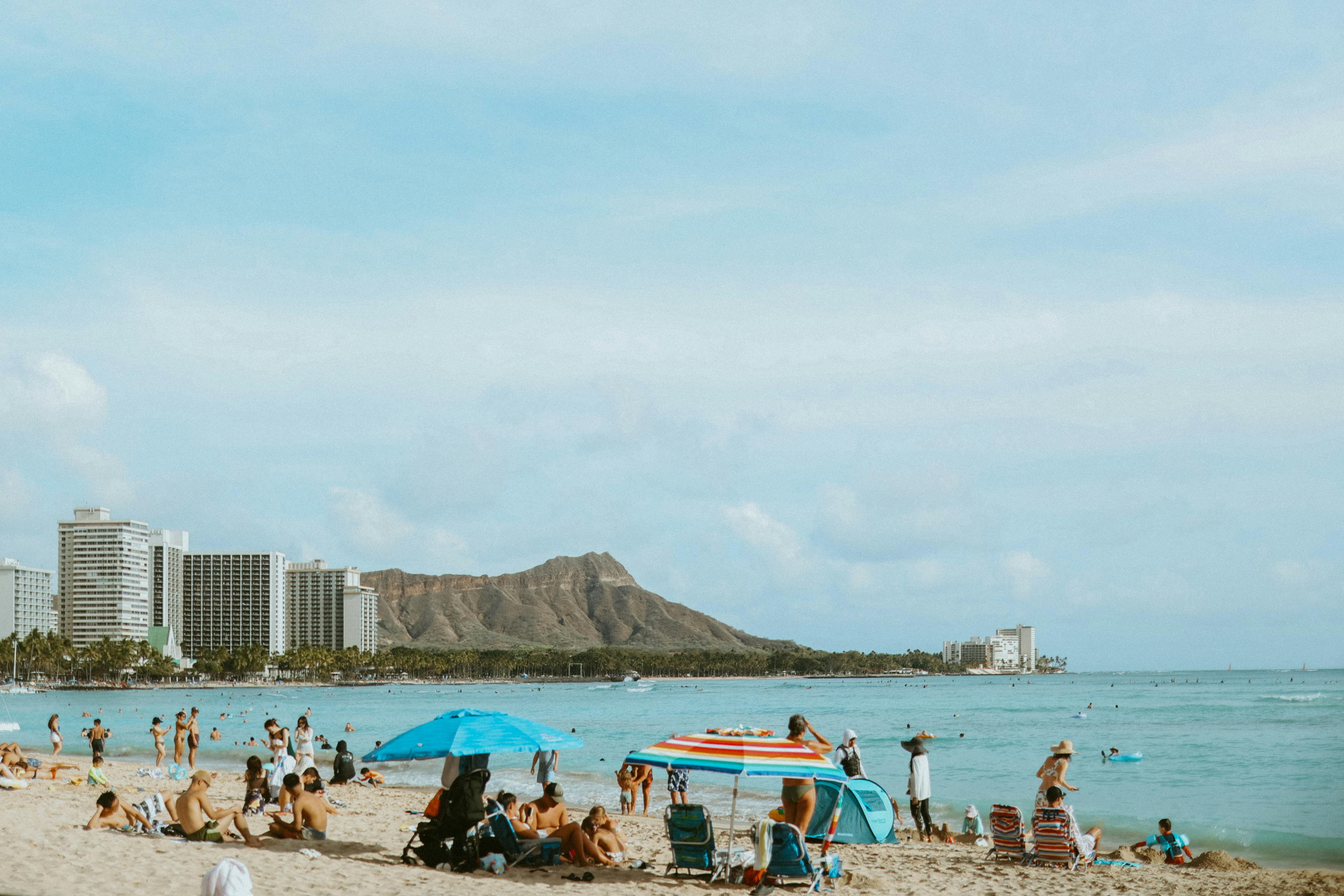 Landscape of People Tanning with Umbrellas on a Beach by the Sea · Free ...