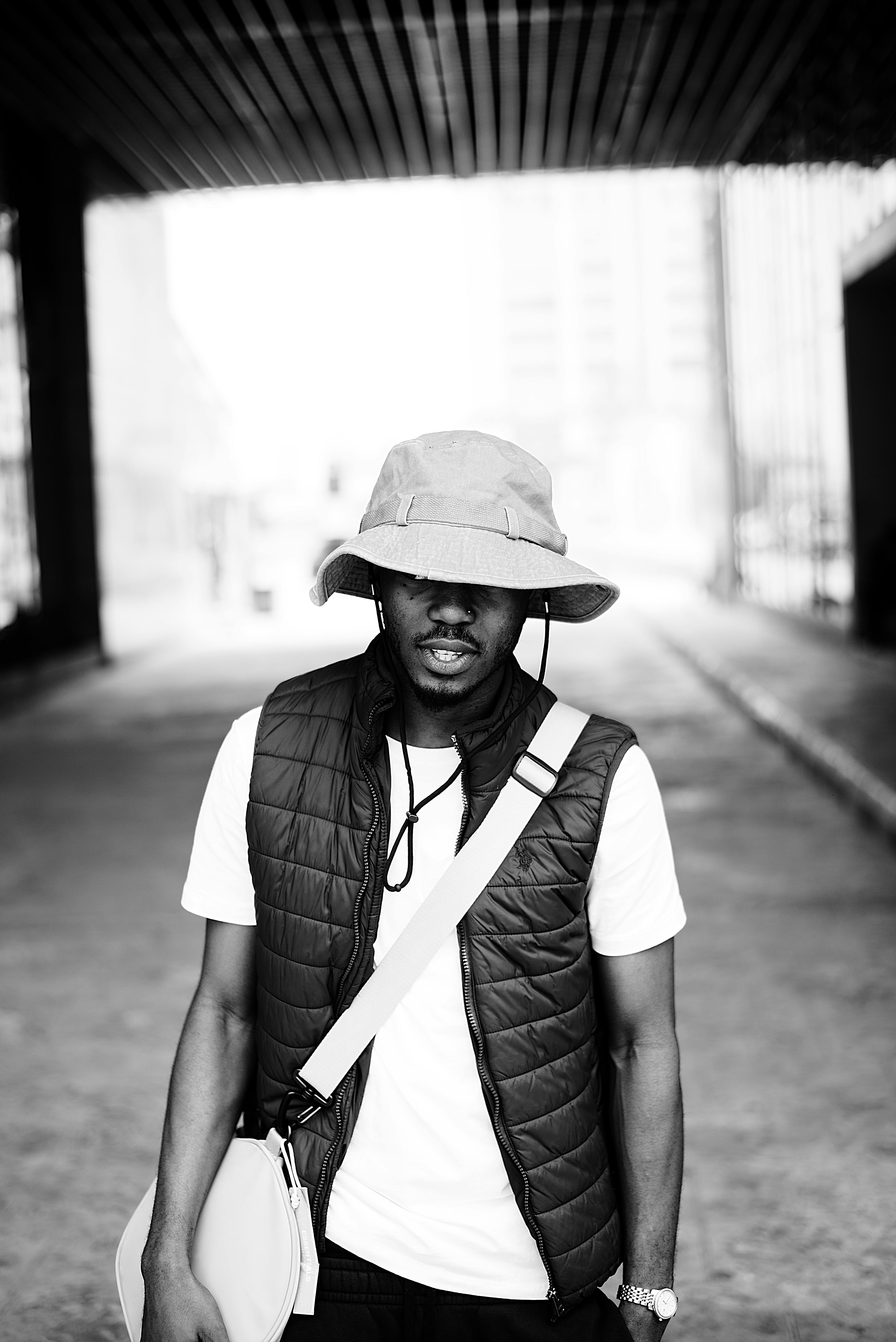 Black and White Photo of a Man Wearing a Hat · Free Stock Photo