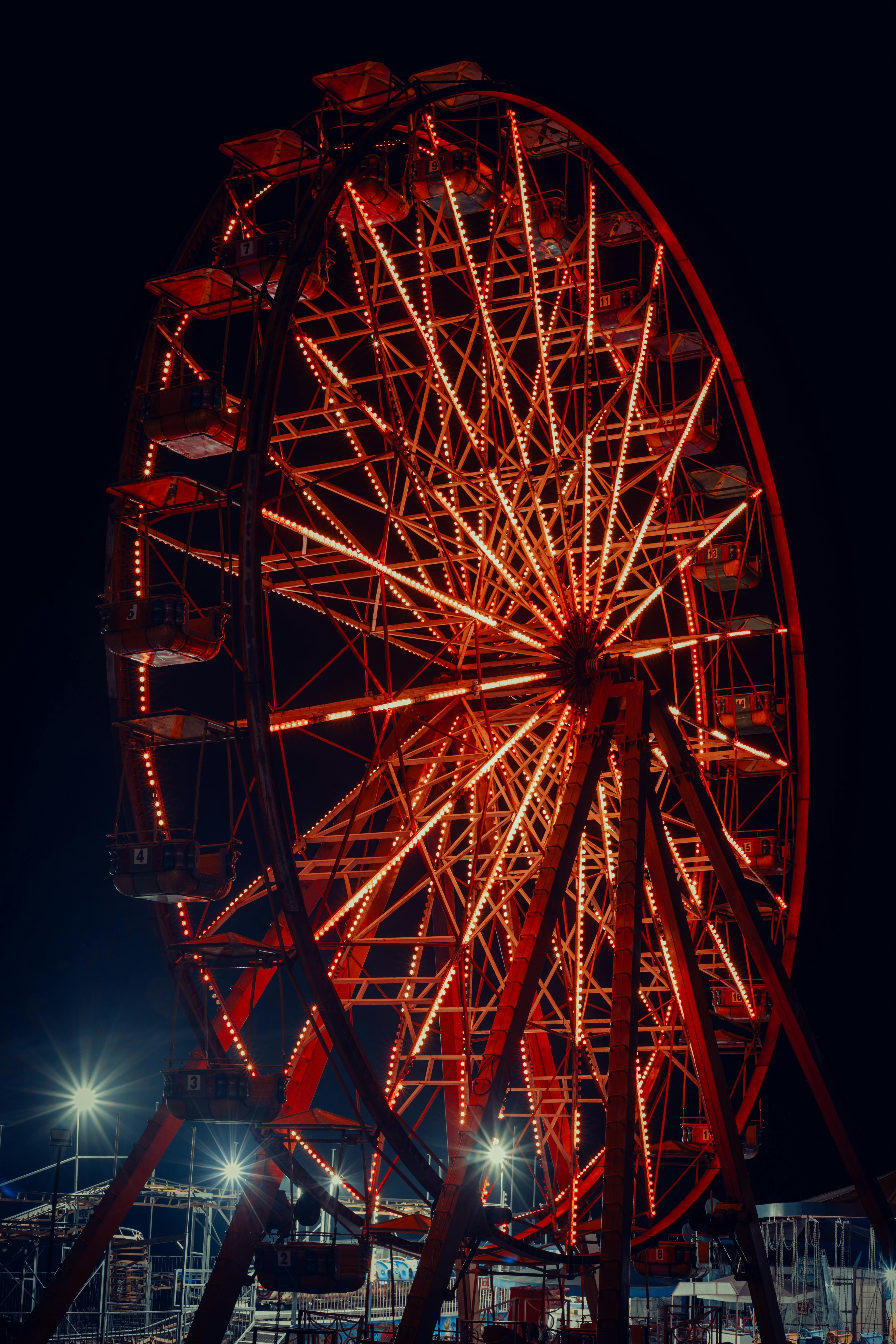 Big Ferris Wheel with Red Neon Lights in the Evening · Free Stock Photo