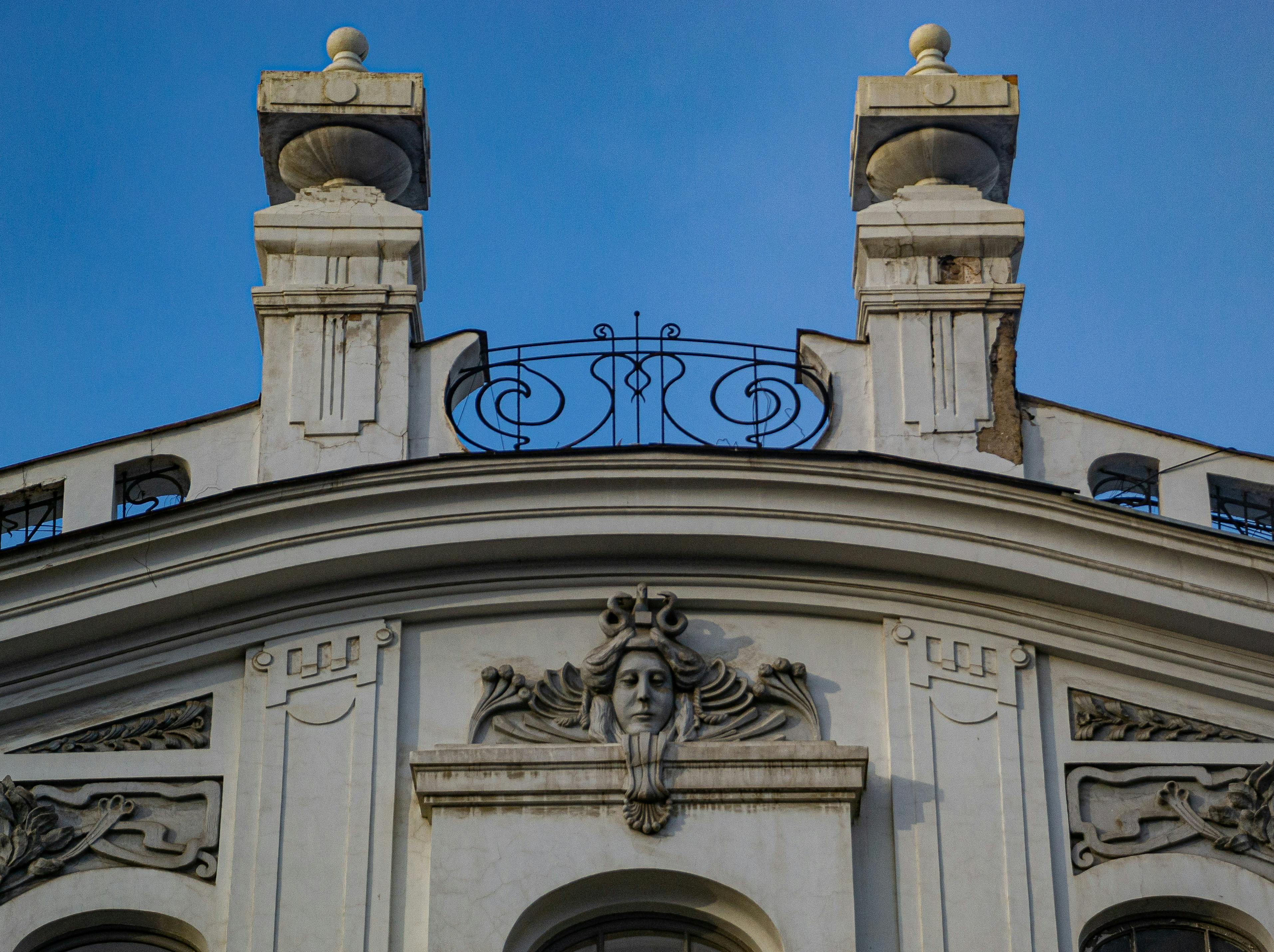Facade of an Ancient Building with Decorative Elements · Free Stock Photo