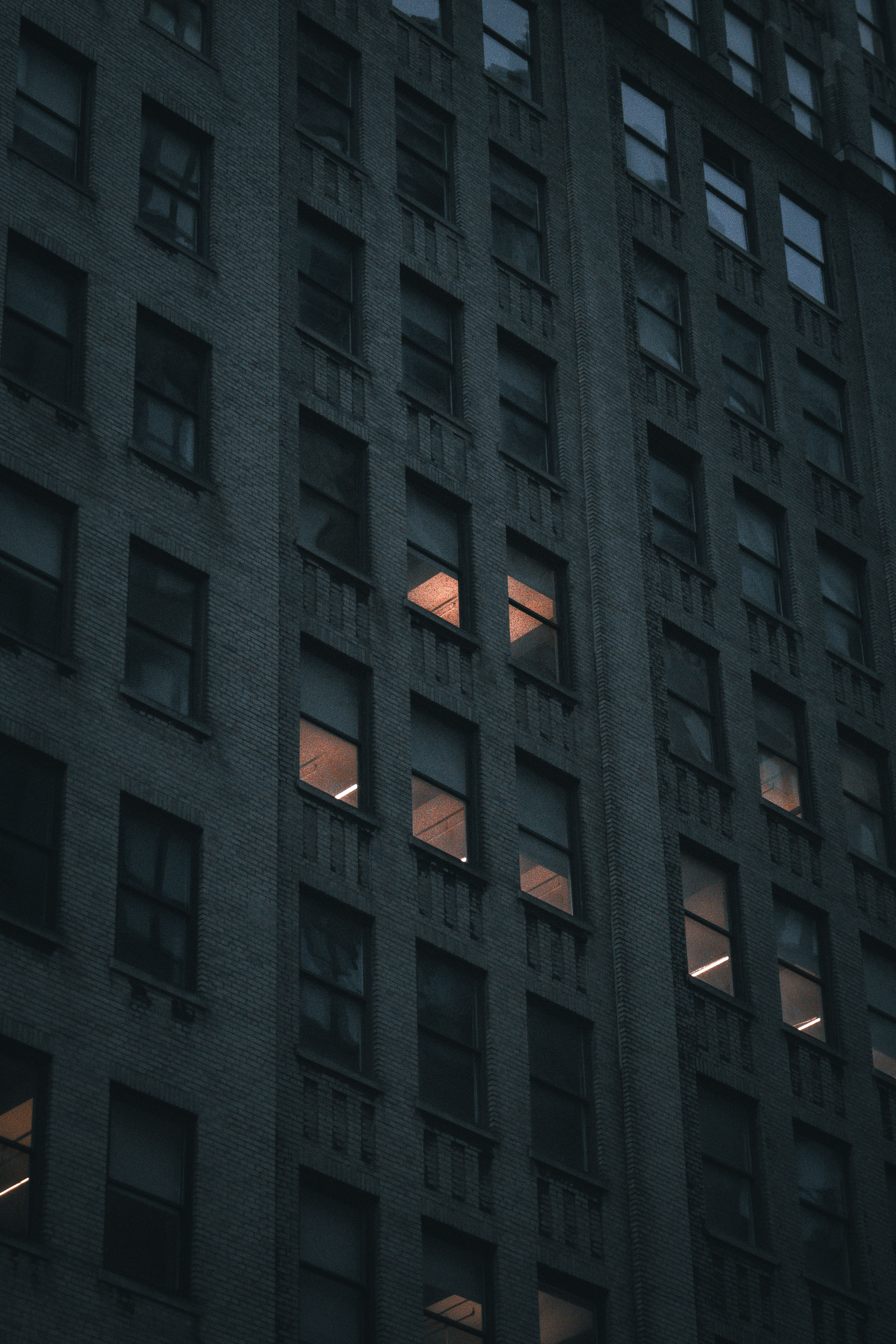 Modern Building with Lights in Some Windows · Free Stock Photo