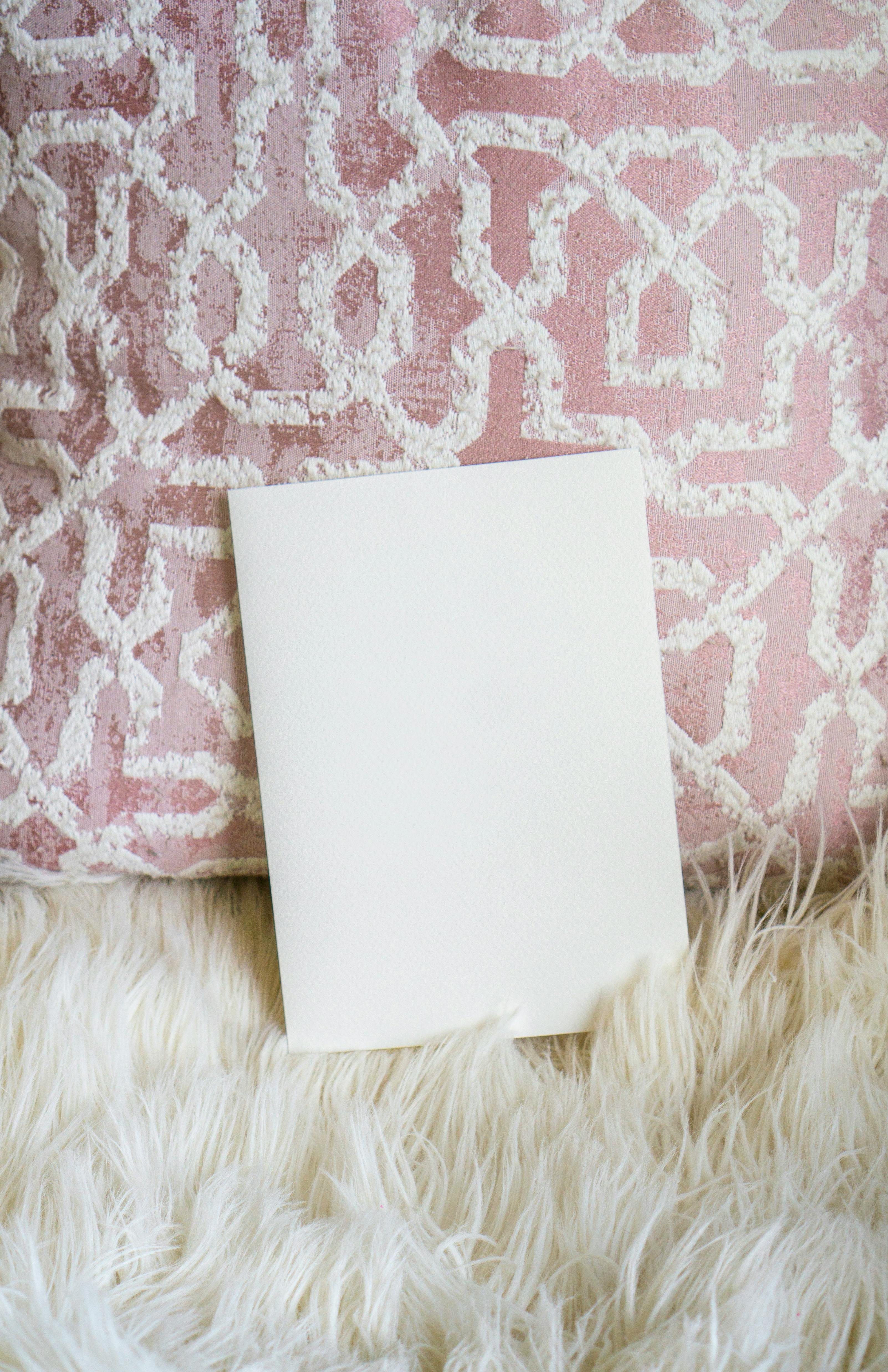Notebook on a Furry Rug · Free Stock Photo