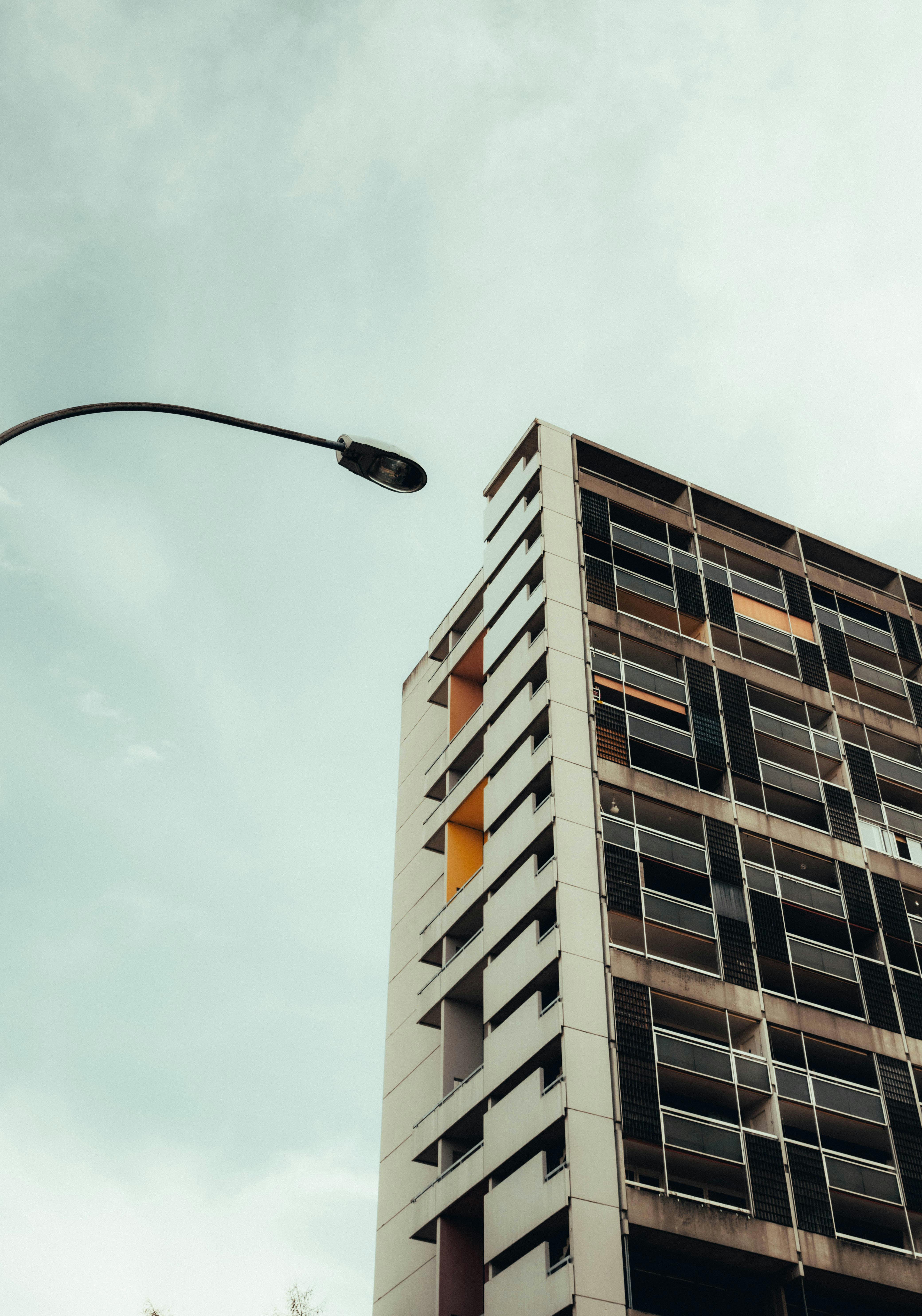 High Rise Building against Cloudy Sky · Free Stock Photo
