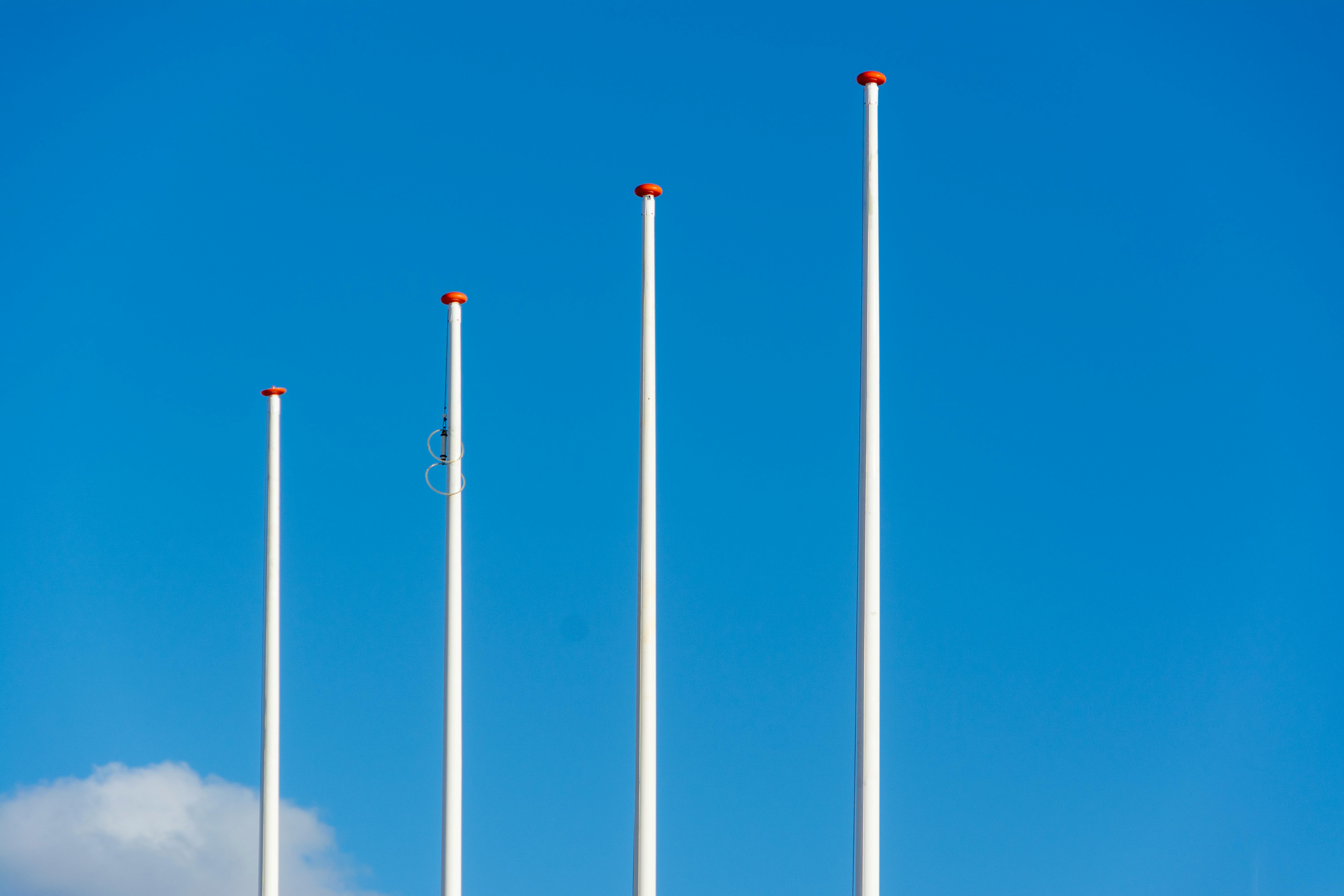 Empty Flagpoles with Red Tips · Free Stock Photo