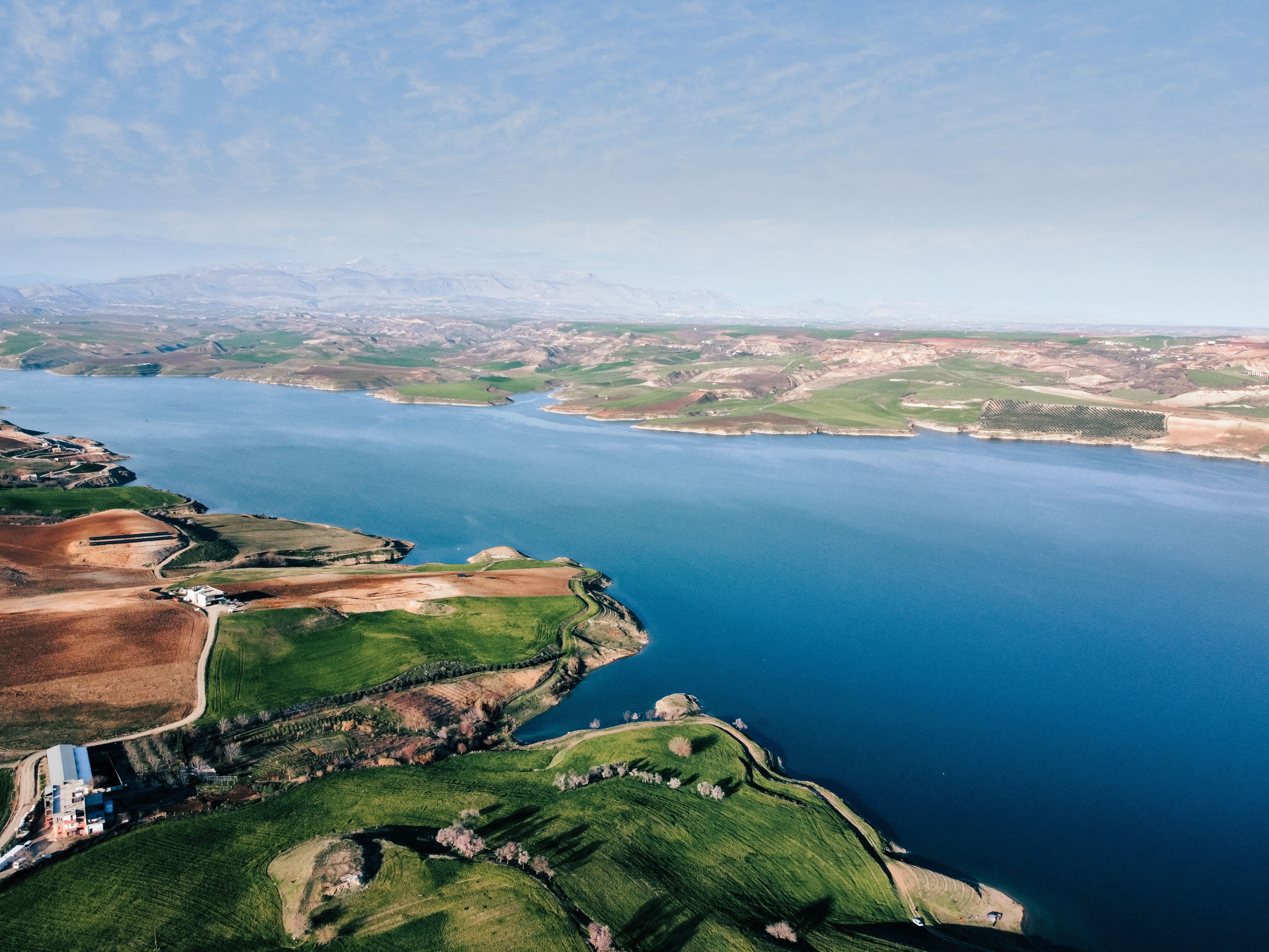 Aerial View of a River and Mountains in Distance · Free Stock Photo