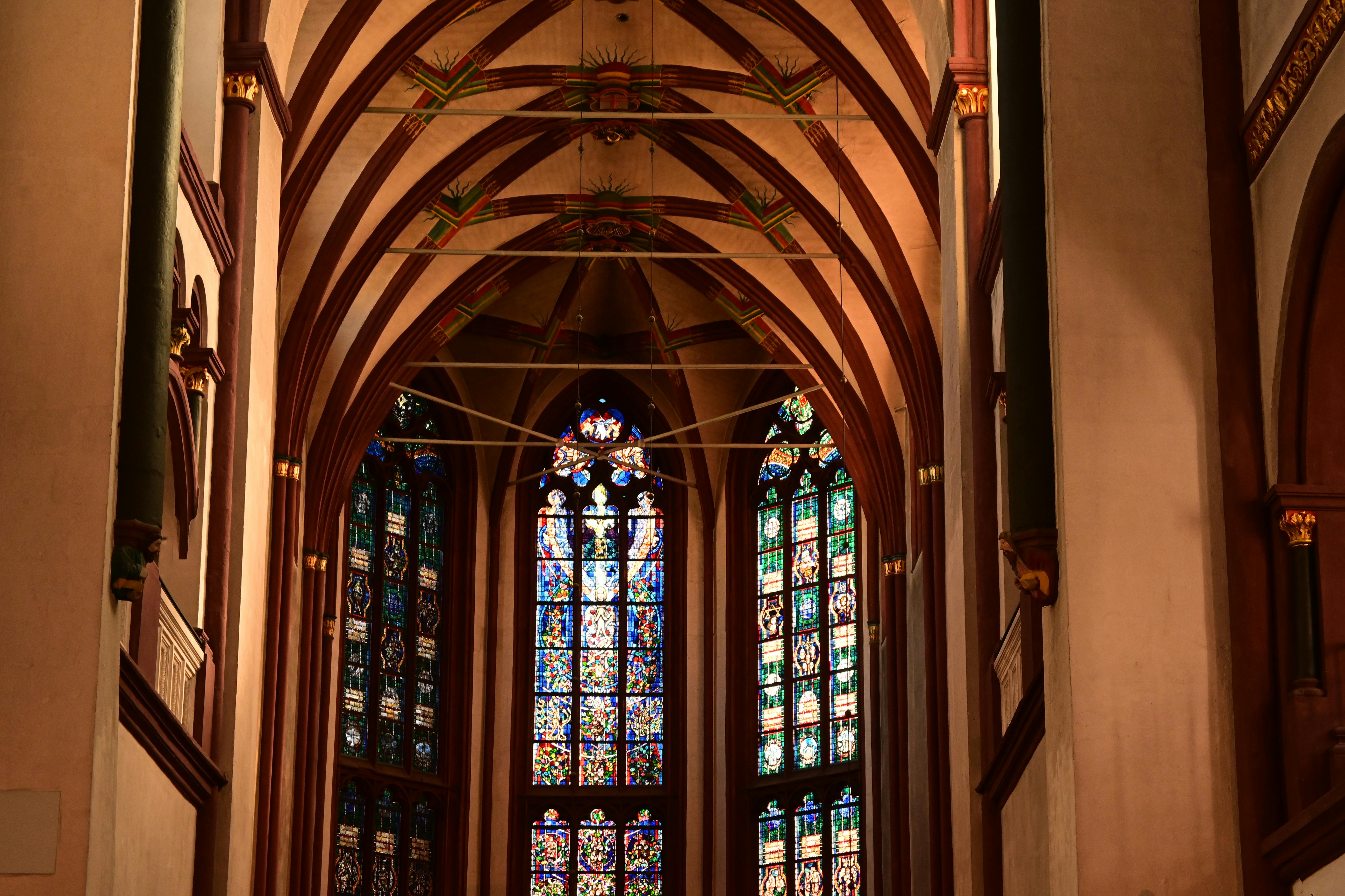Monumental Church Interior with Stained Glass Windows · Free Stock Photo