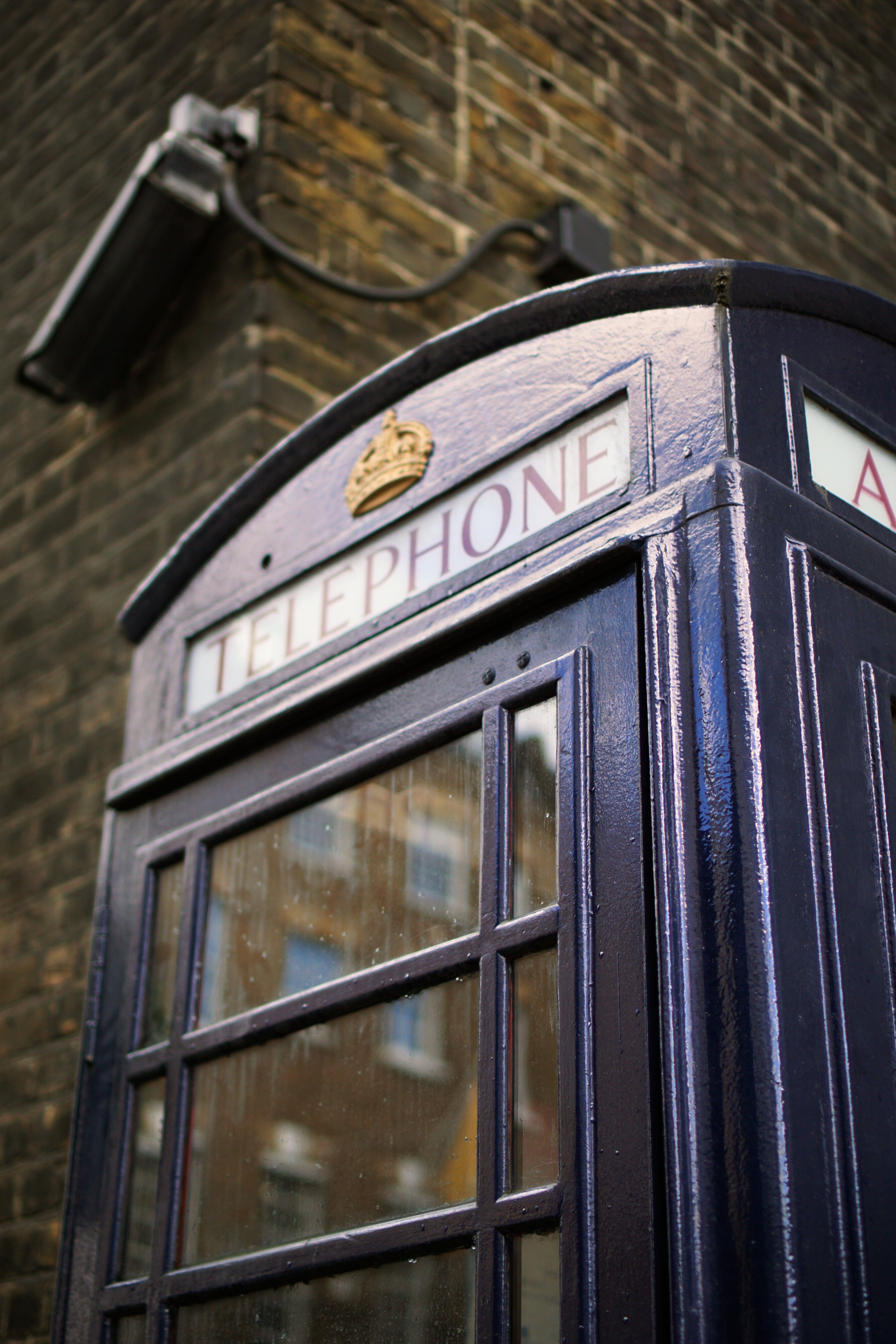 Classic Red British Telephone Booth in Autumn · Free Stock Photo