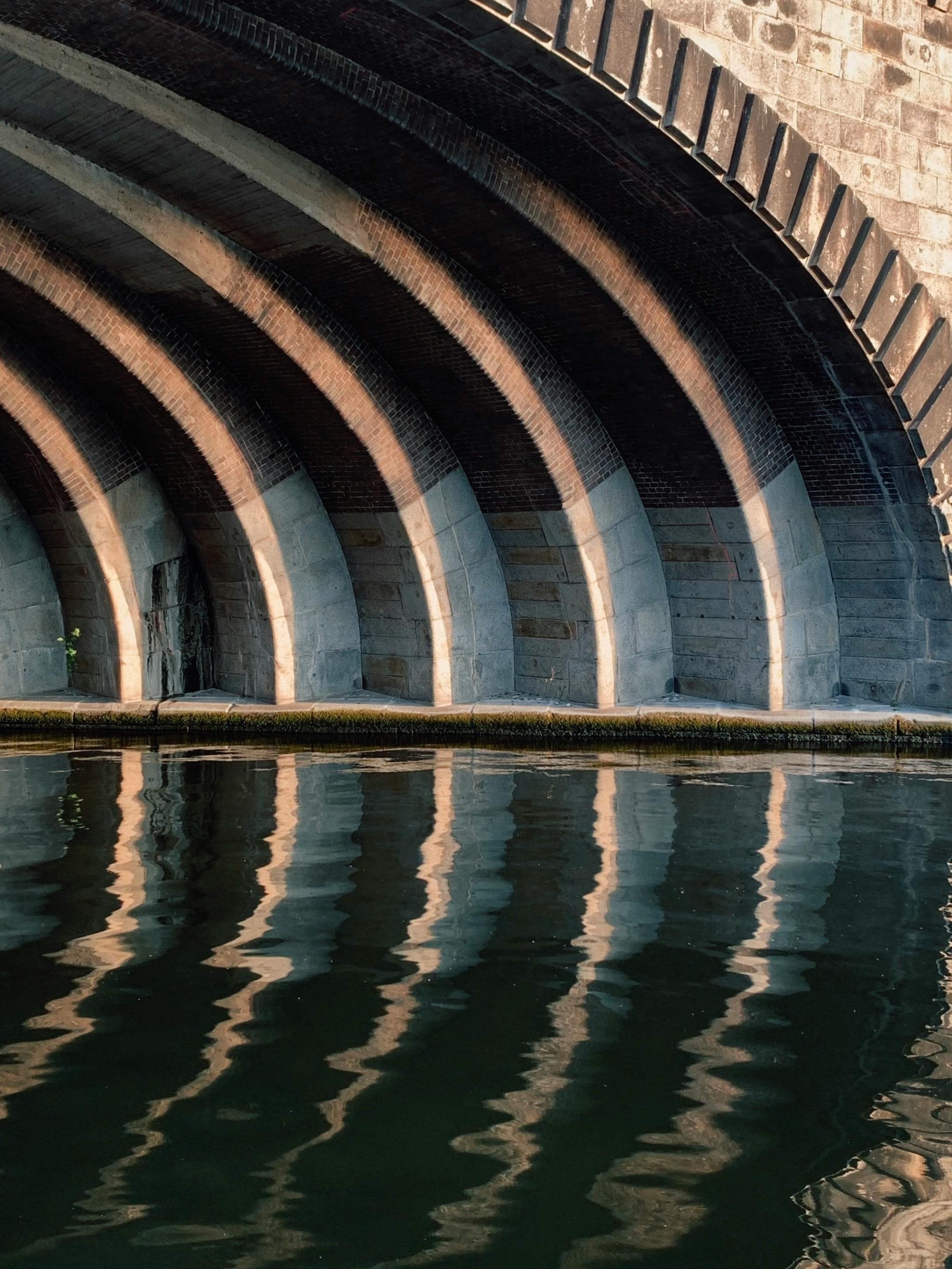 Arches on Wall over River · Free Stock Photo