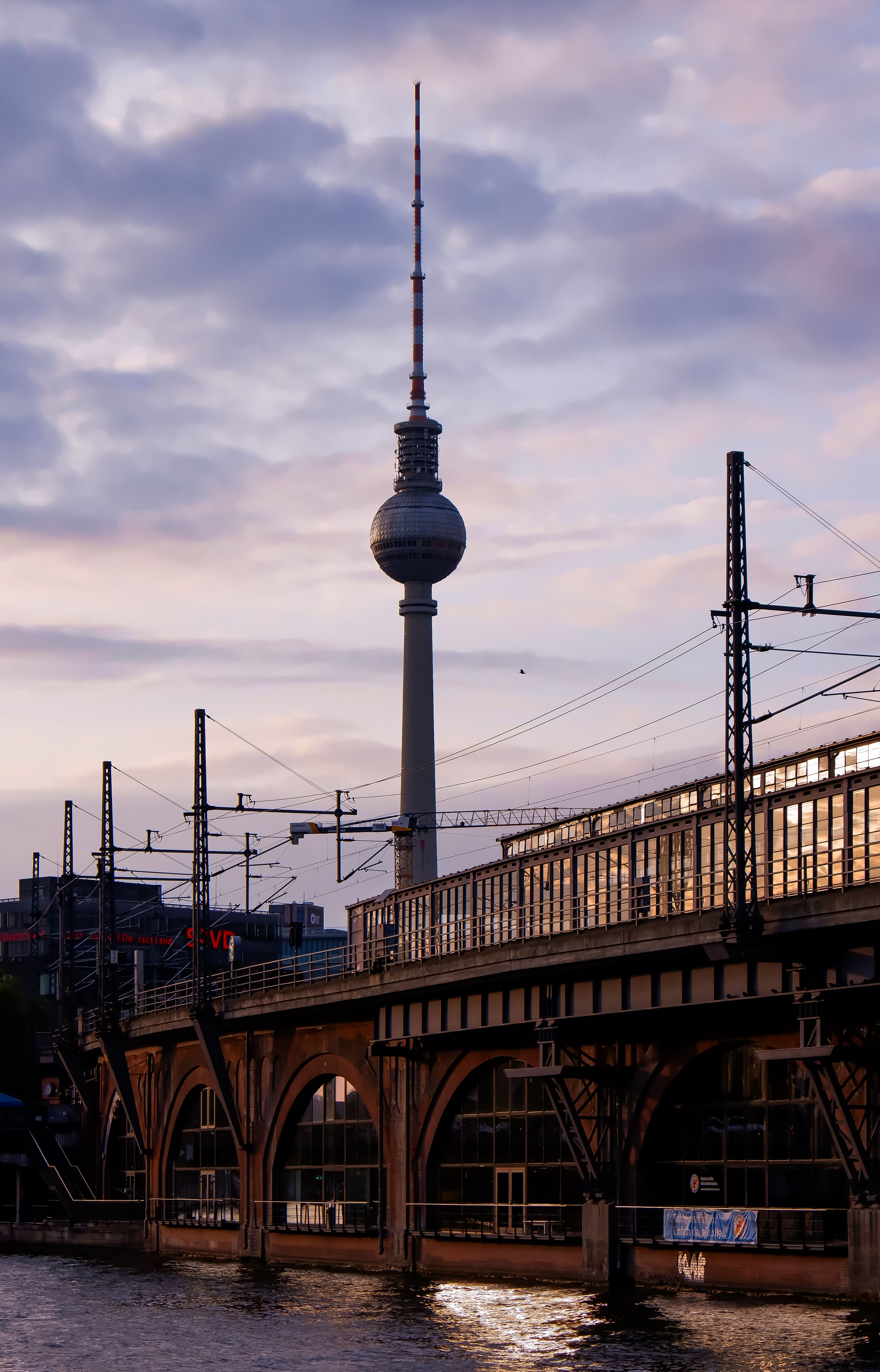 Iconic Berlin TV Tower Overlooking the Spree River · Free Stock Photo
